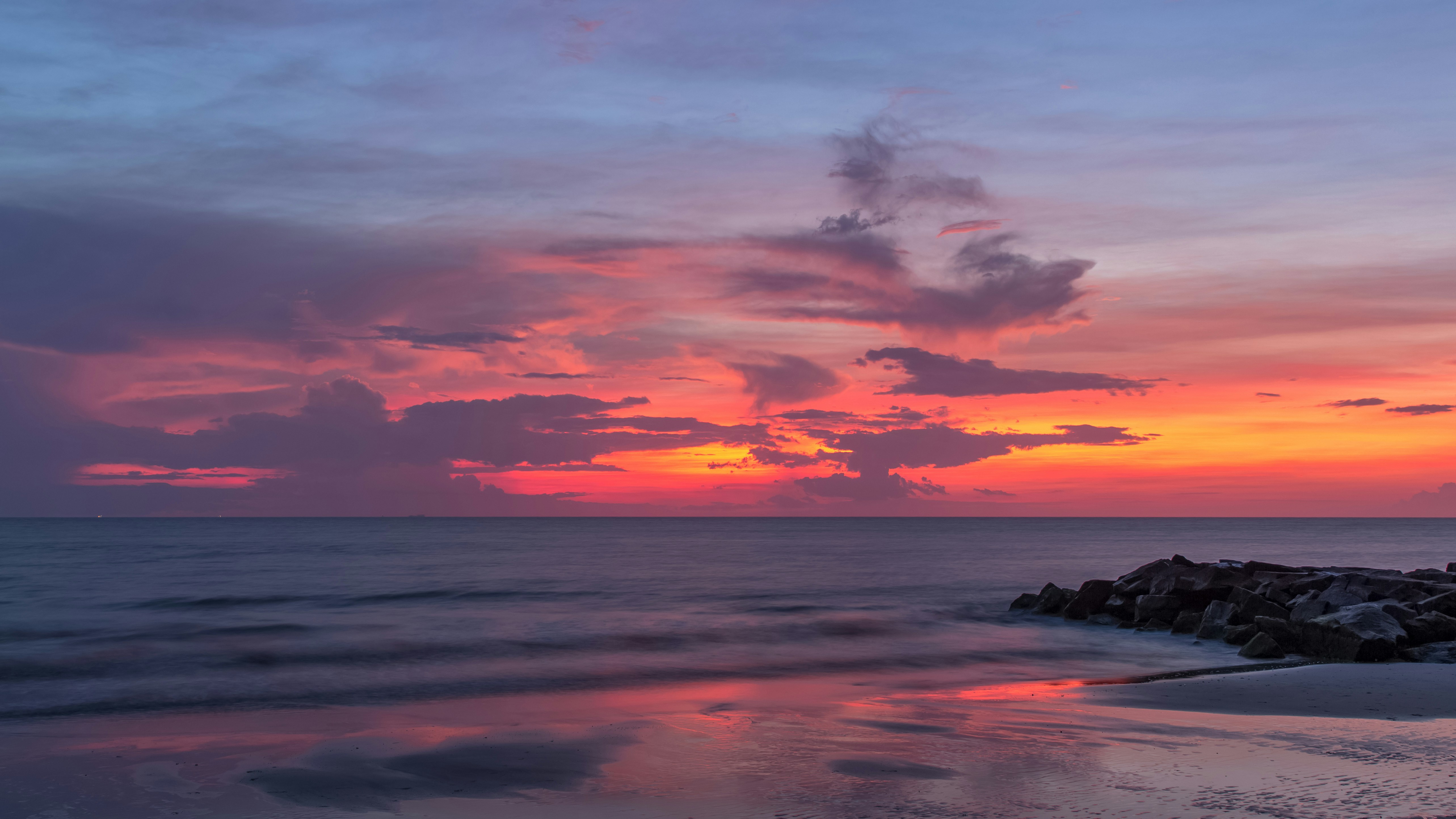 A vibrant sunset reflects over the calm ocean. photo – Free Sunset ...