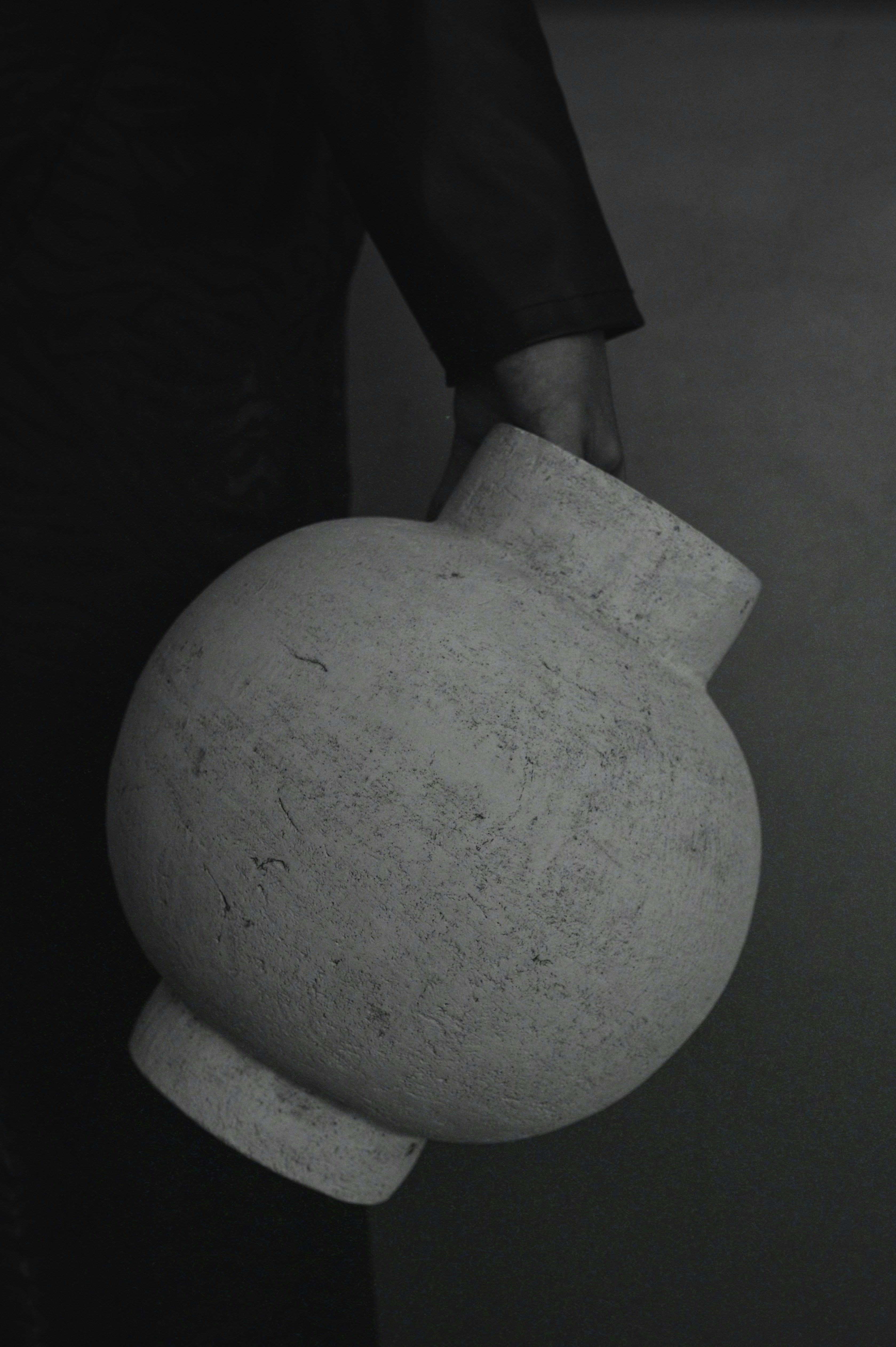 Grasped Vessel in Monochrome: A Quiet Clay Portrait
