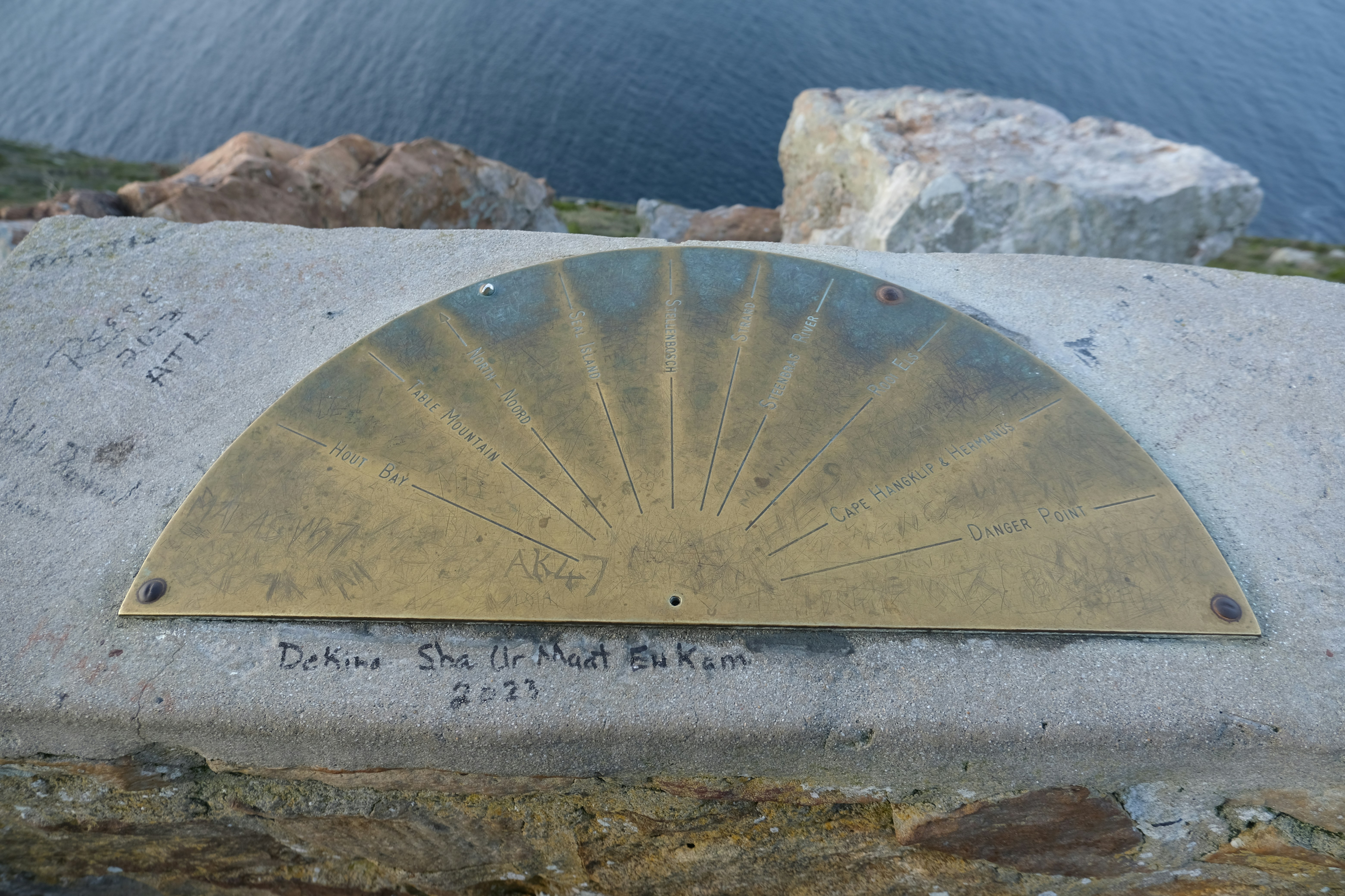 Bronze Sundial on Stone Terrace Overlooking the Sea