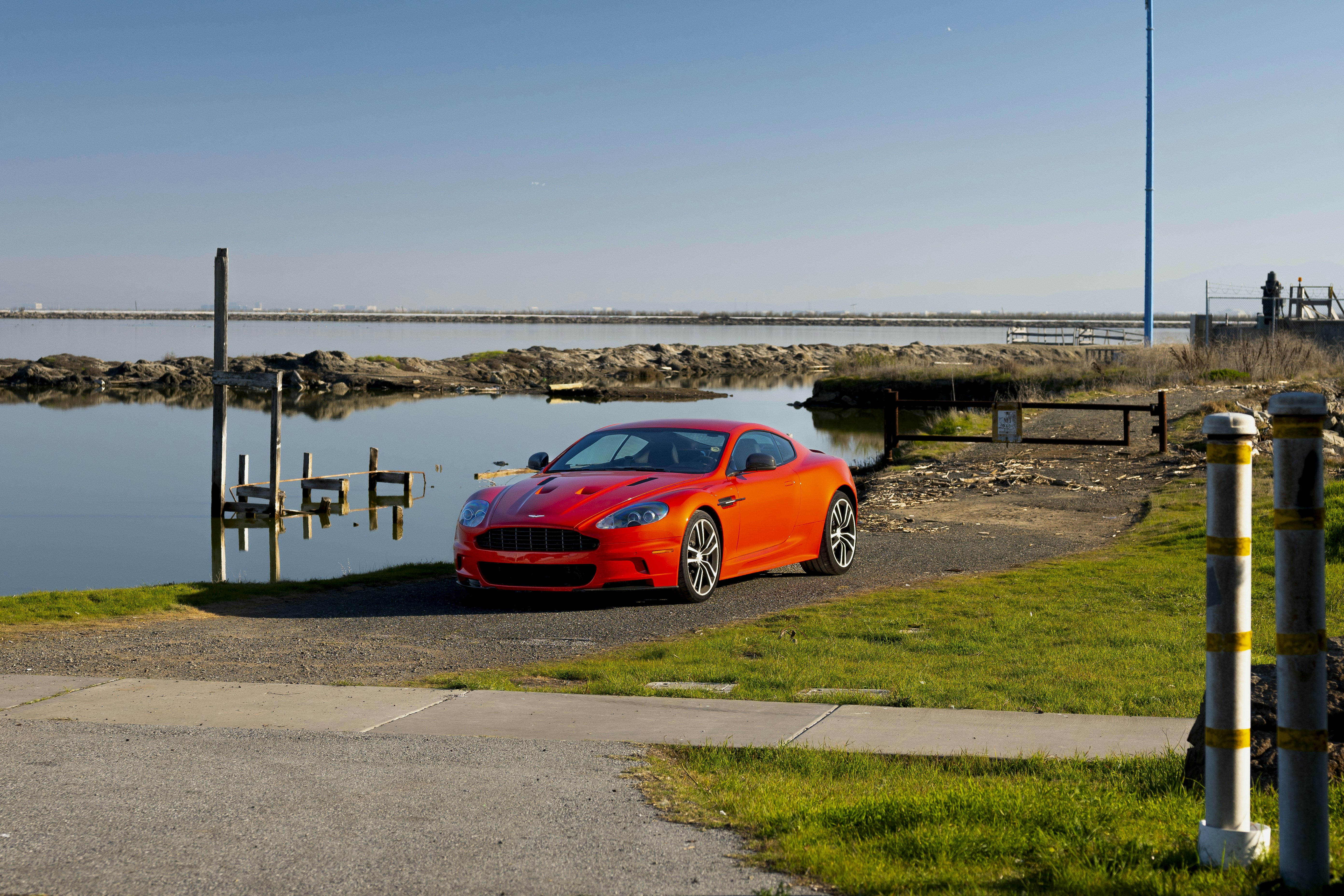 A red sports car parked near the water. photo – Free Car Image on Unsplash