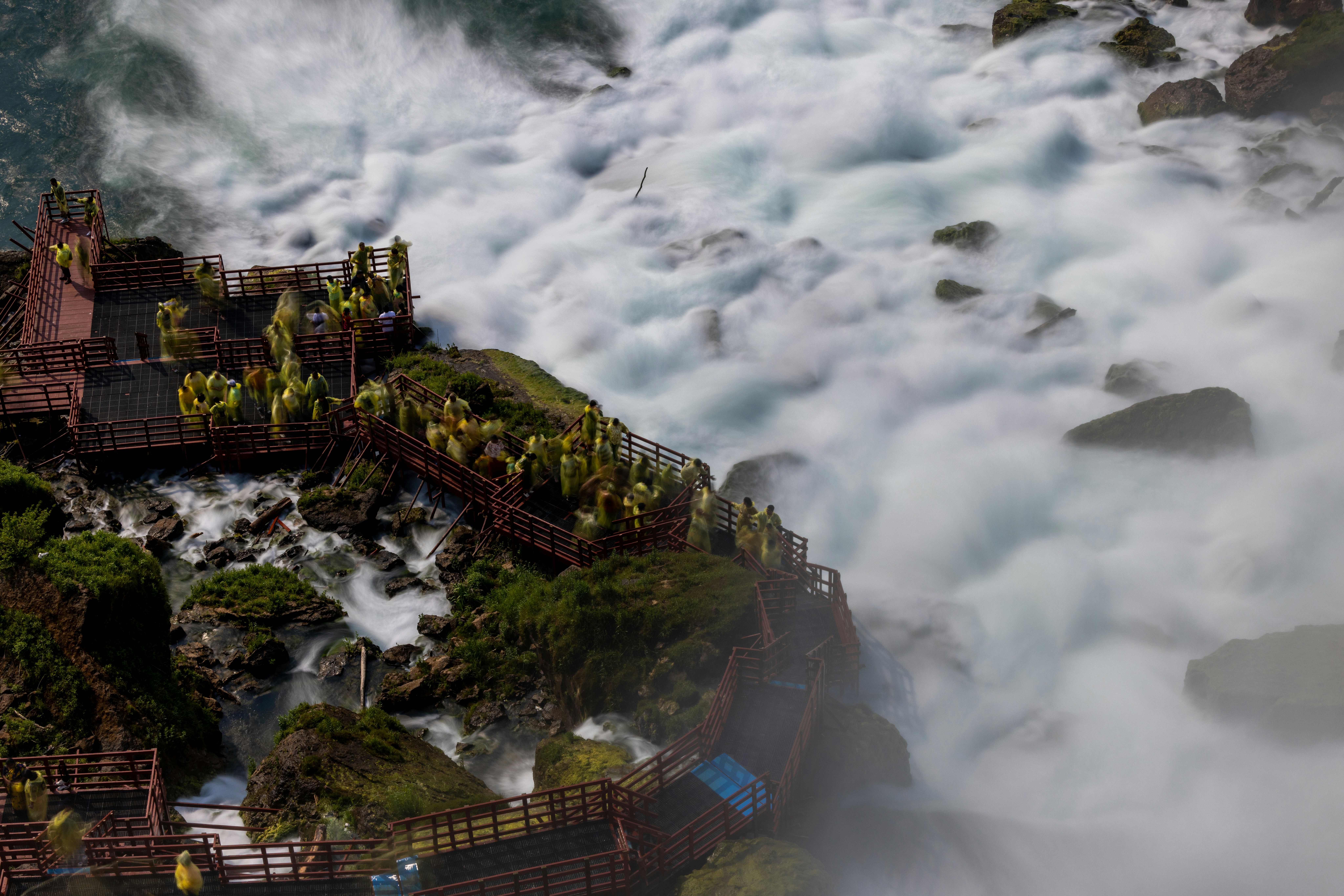 Mist Veil at the Tiers: A cliffside path through cascading spray