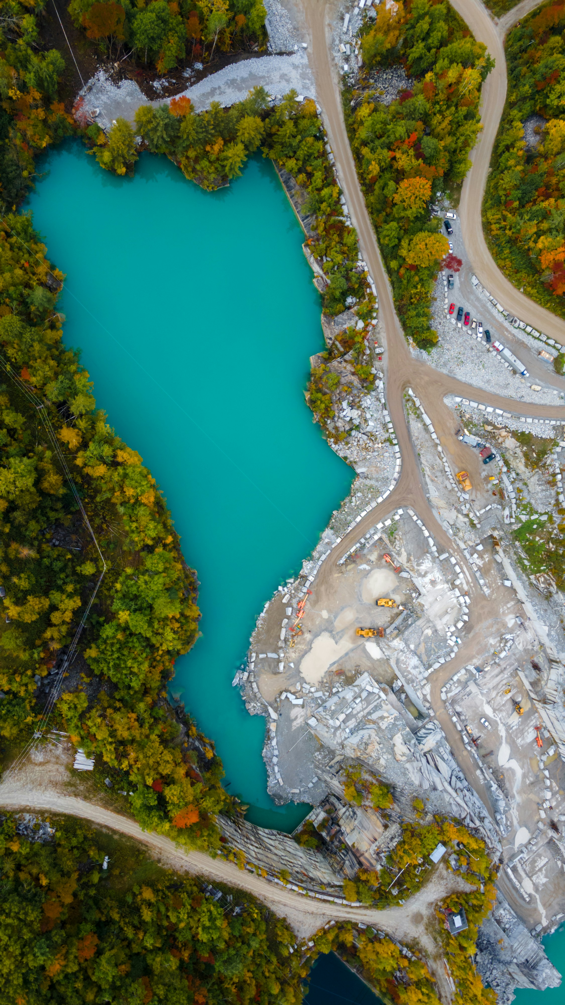 An aerial view of a quarry and teal lake. photo – Free Fall Image on ...