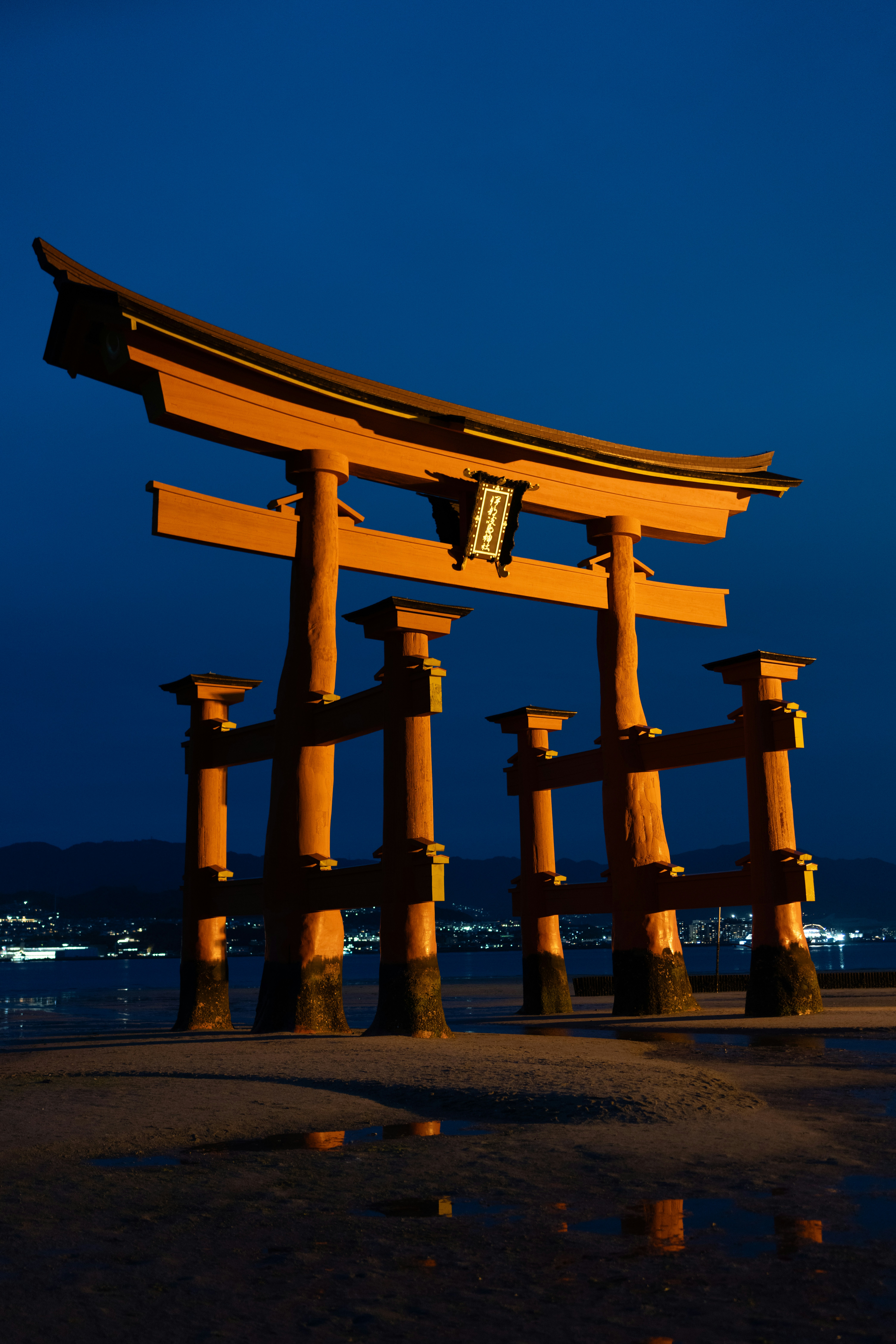 A majestic torii gate stands against the night sky. photo – Free Image ...