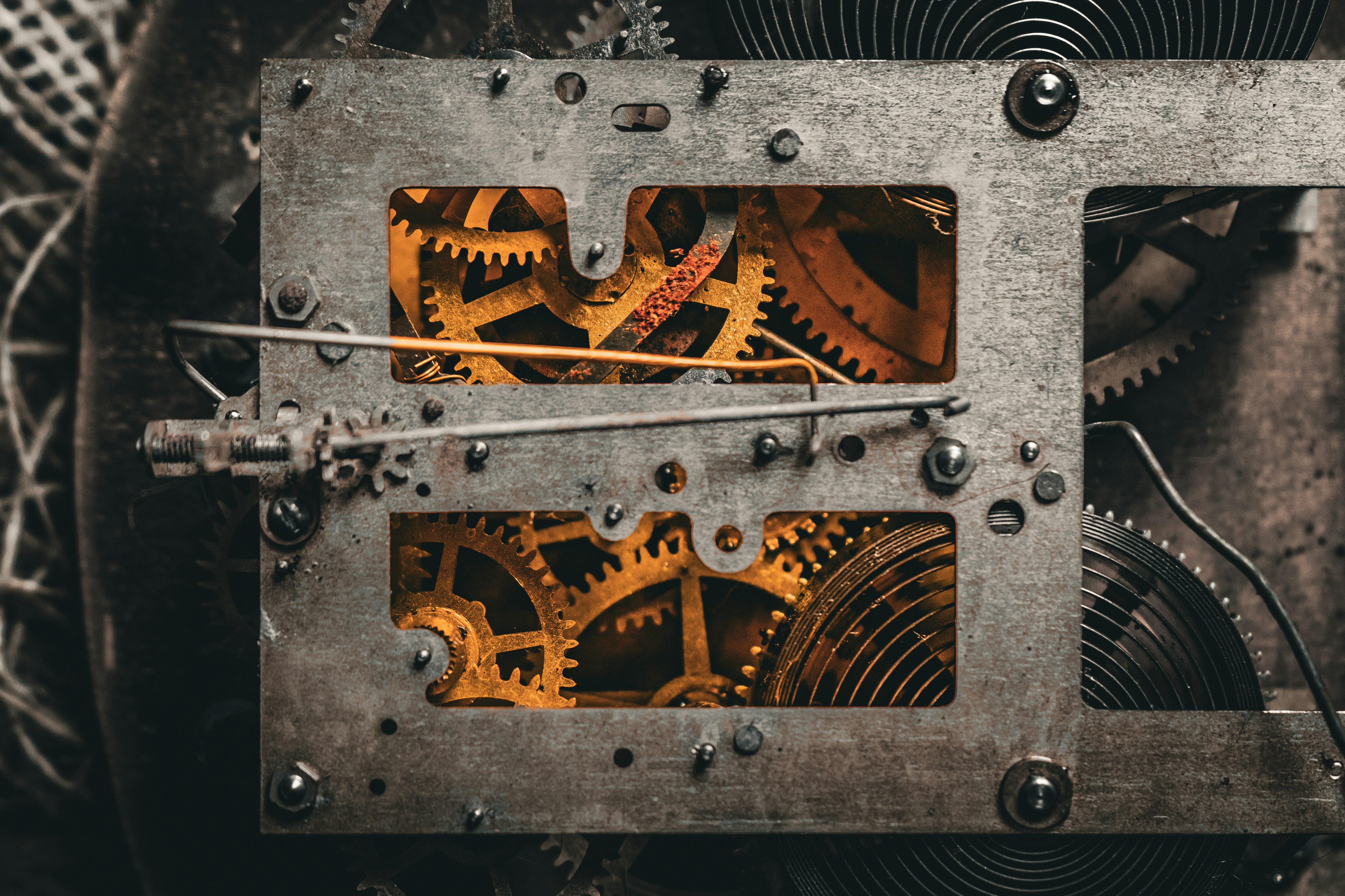 Clock gears and mechanisms are revealed. photo – Free Image on Unsplash