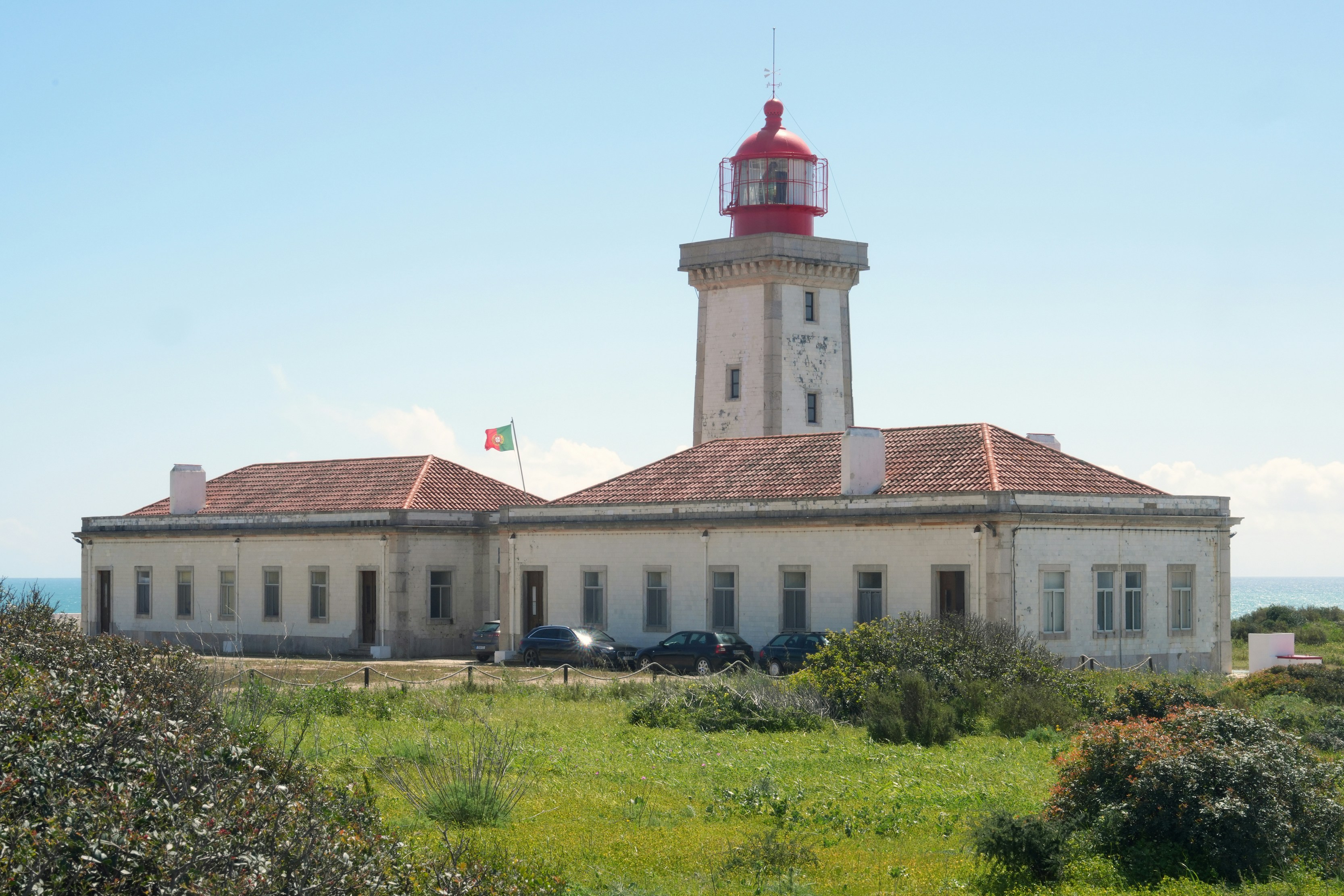 Red Lantern on a Seafront Outpost: A Quiet Portuguese Lighthouse Scene