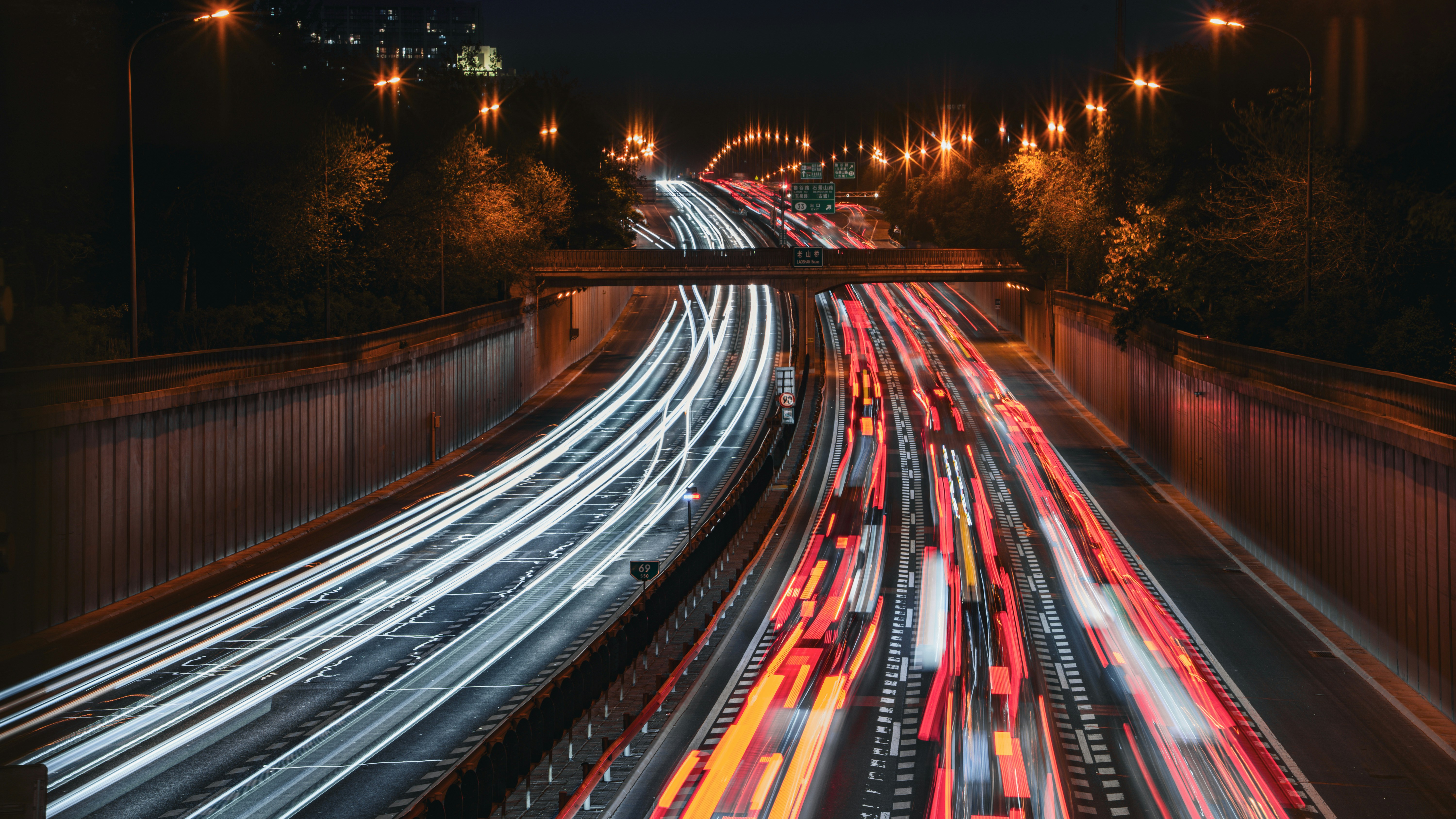 Nighttime traffic lights create long exposure streaks. photo – Free China Image on Unsplash