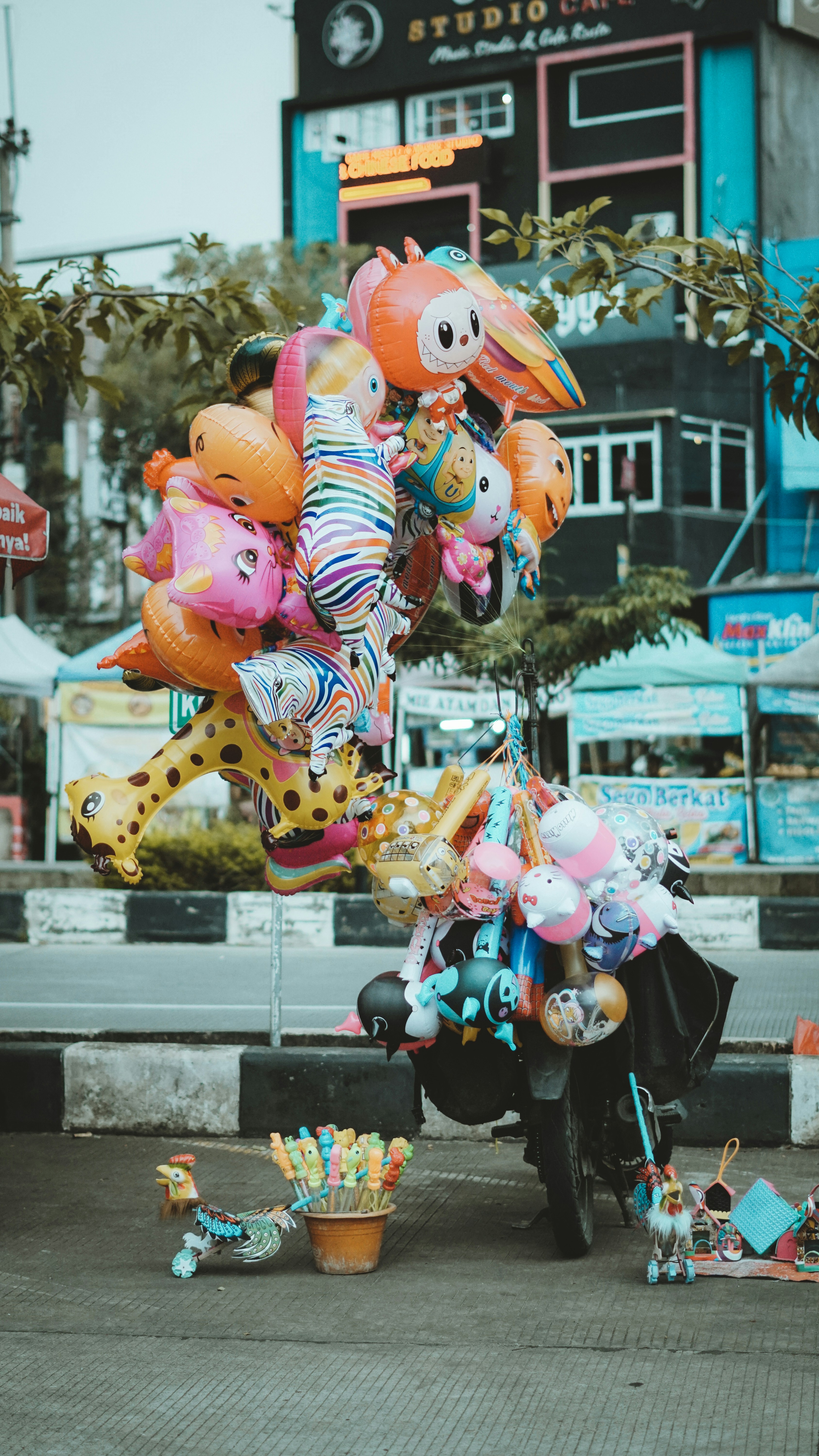 Floating Carnival: Balloon Bouquet Anchored by a Bicycle