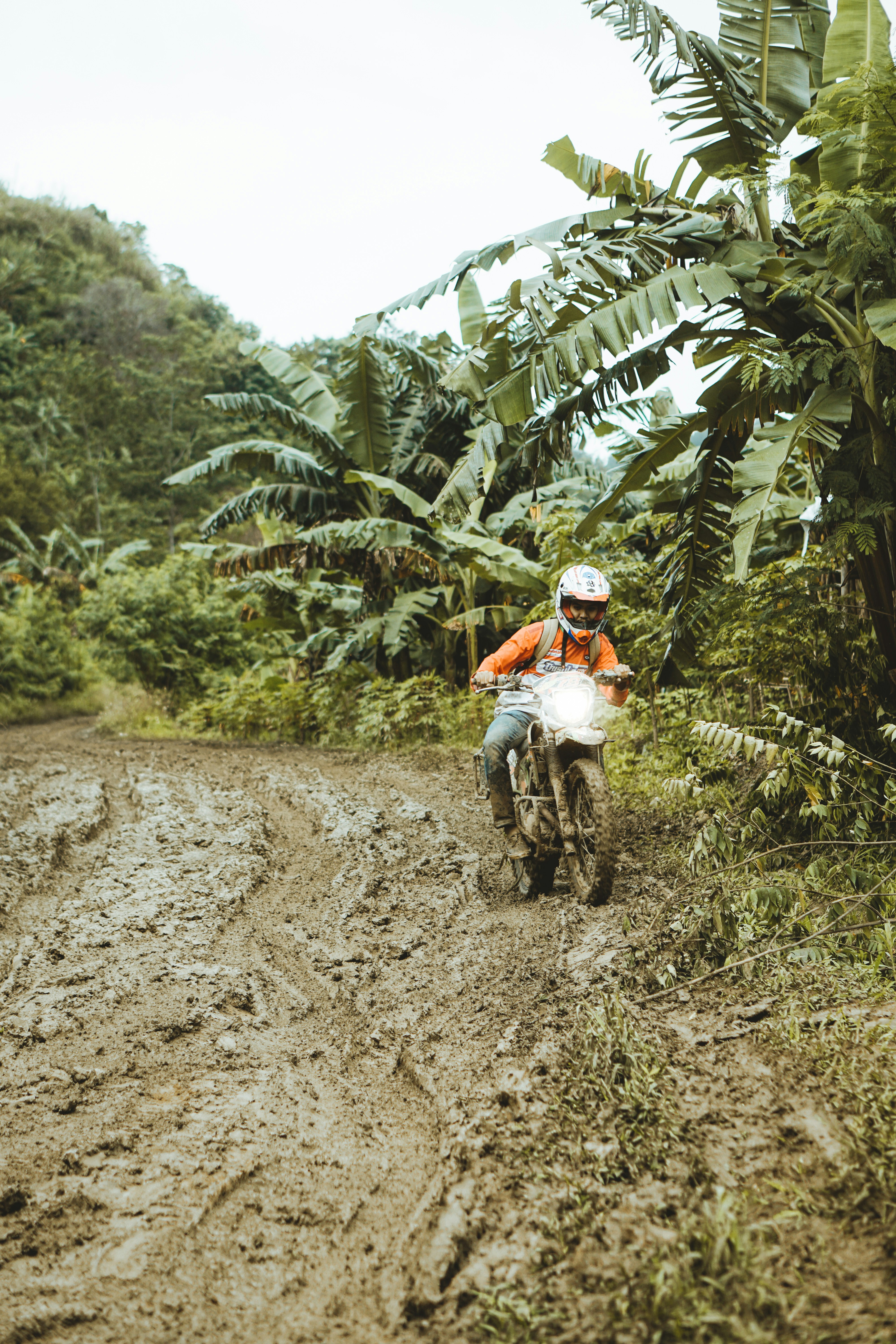 Mud-Splashed Rider Tackles a Jungle Mud Trail