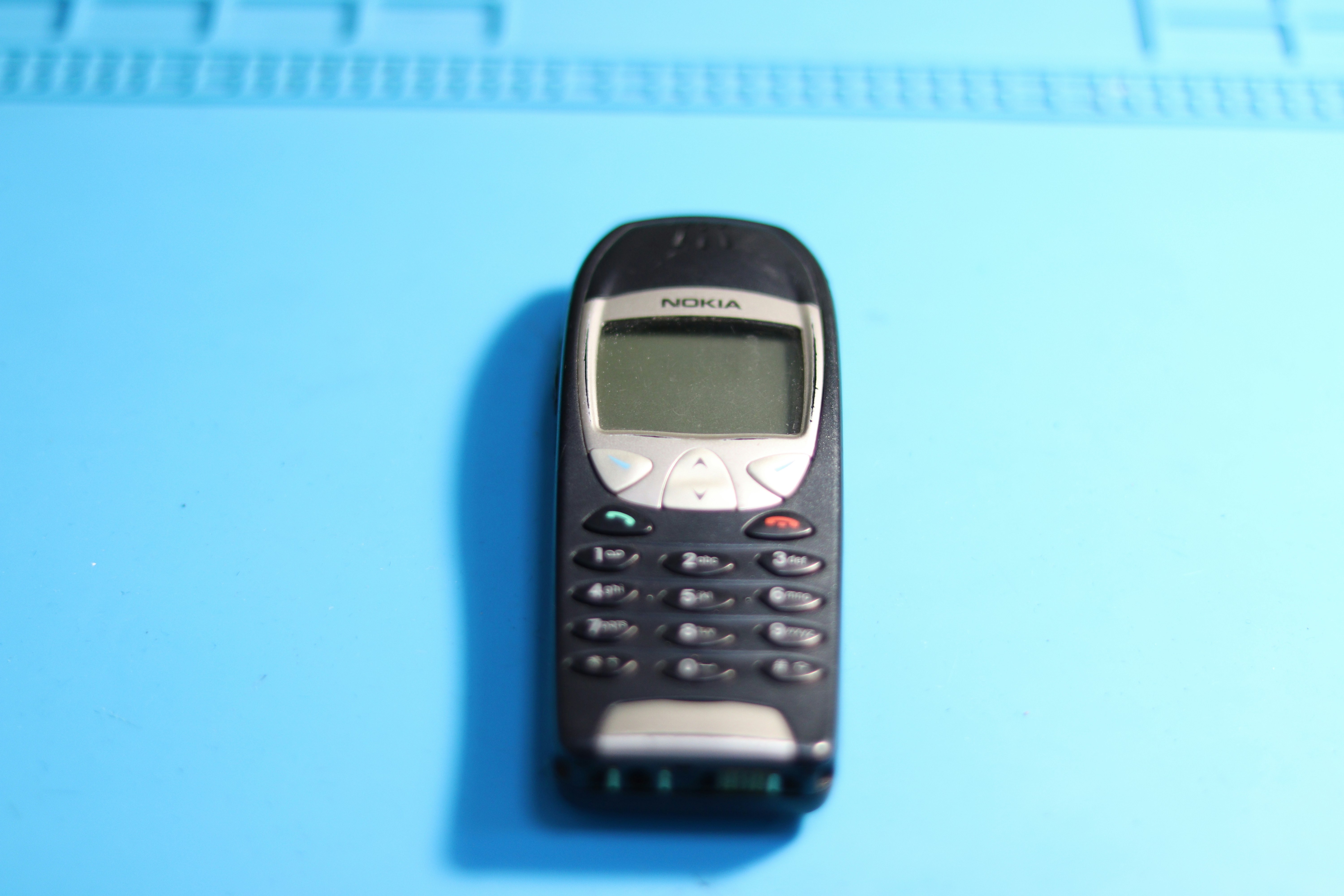 Blue Studio Still Life: A Classic Nokia Feature Phone in Clean Close-Up