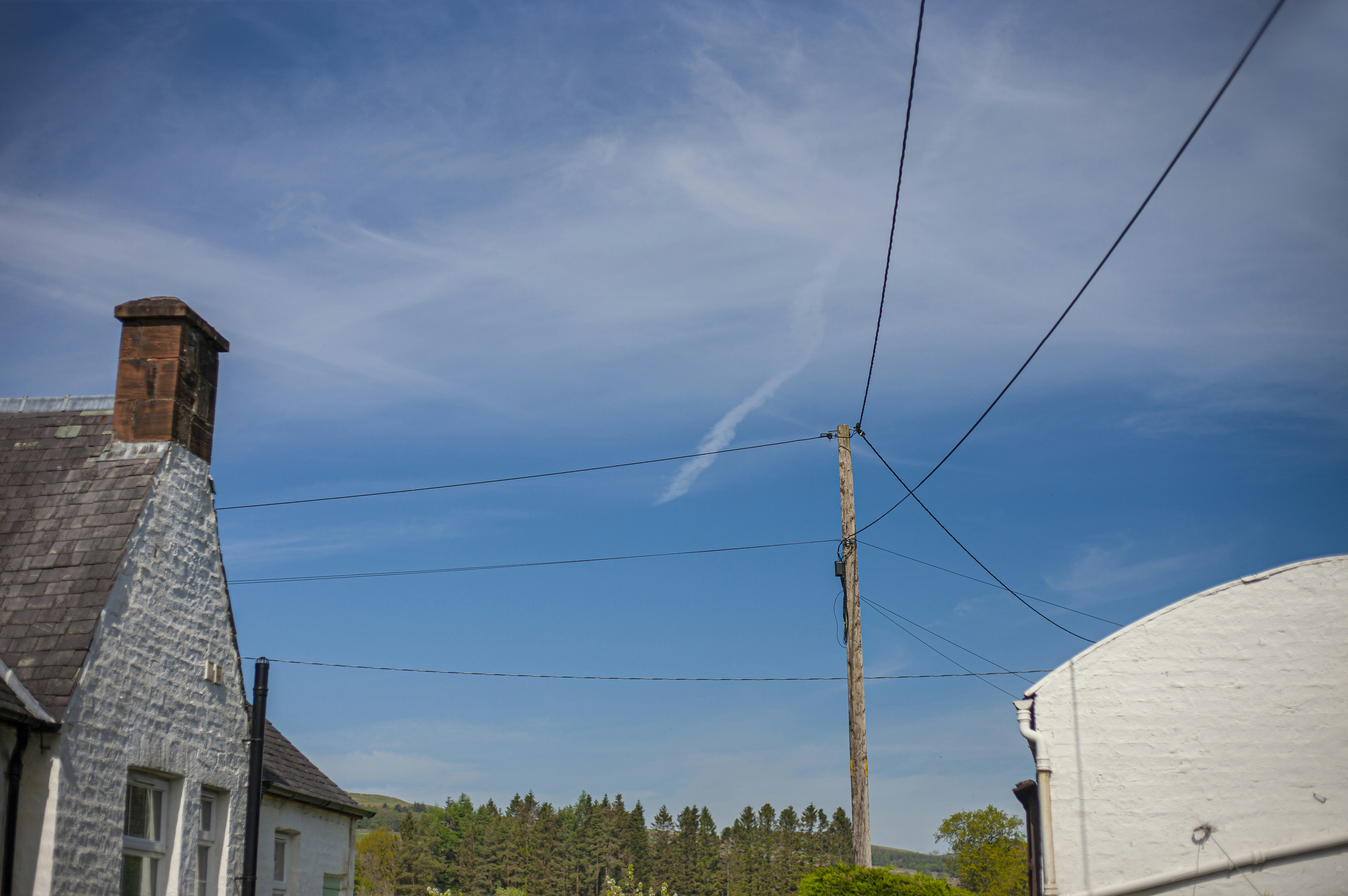 Blue Sky Over Quiet Village Rooflines