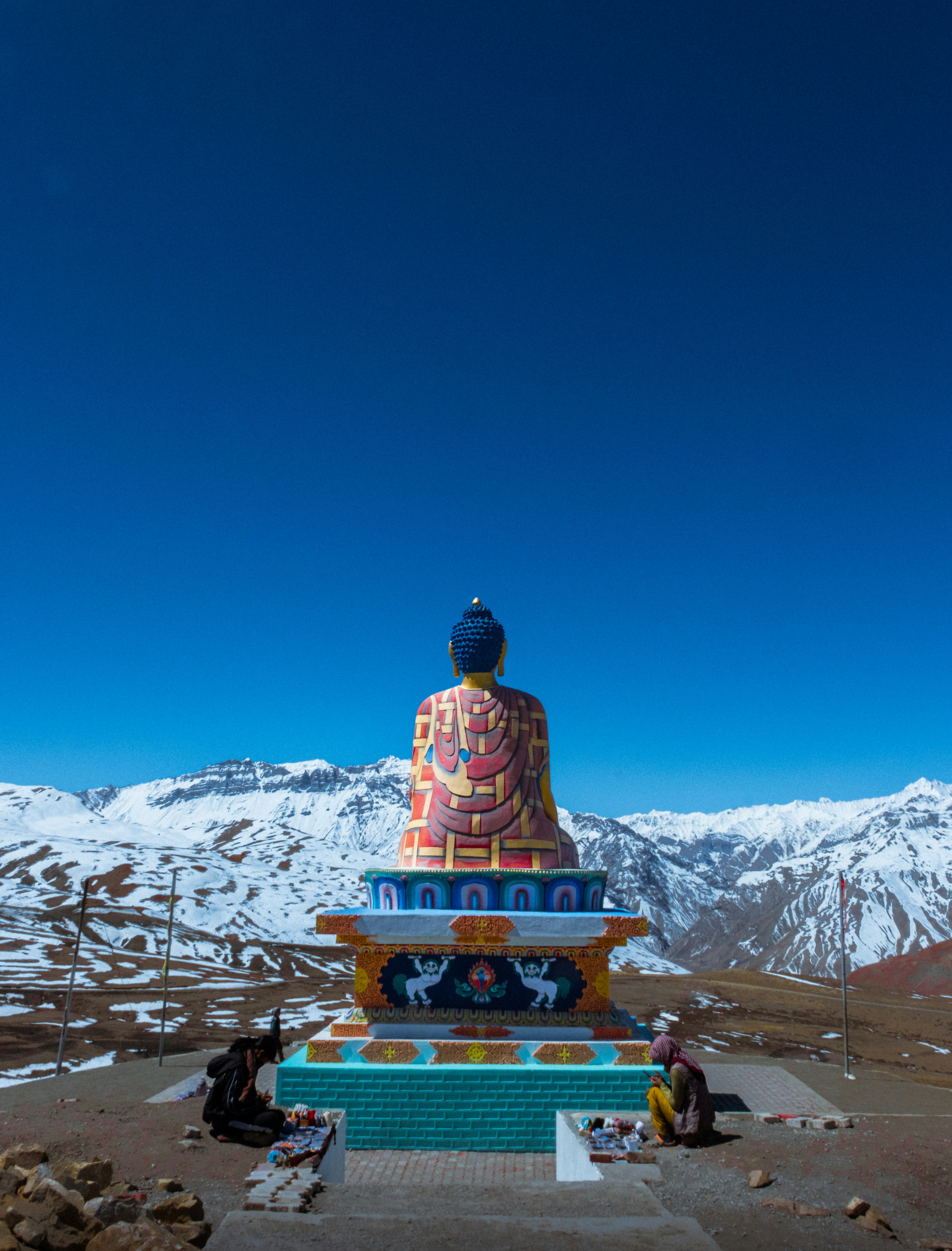 Cerulean Sky Over a Multicolored Buddha on a Himalayan Platform
