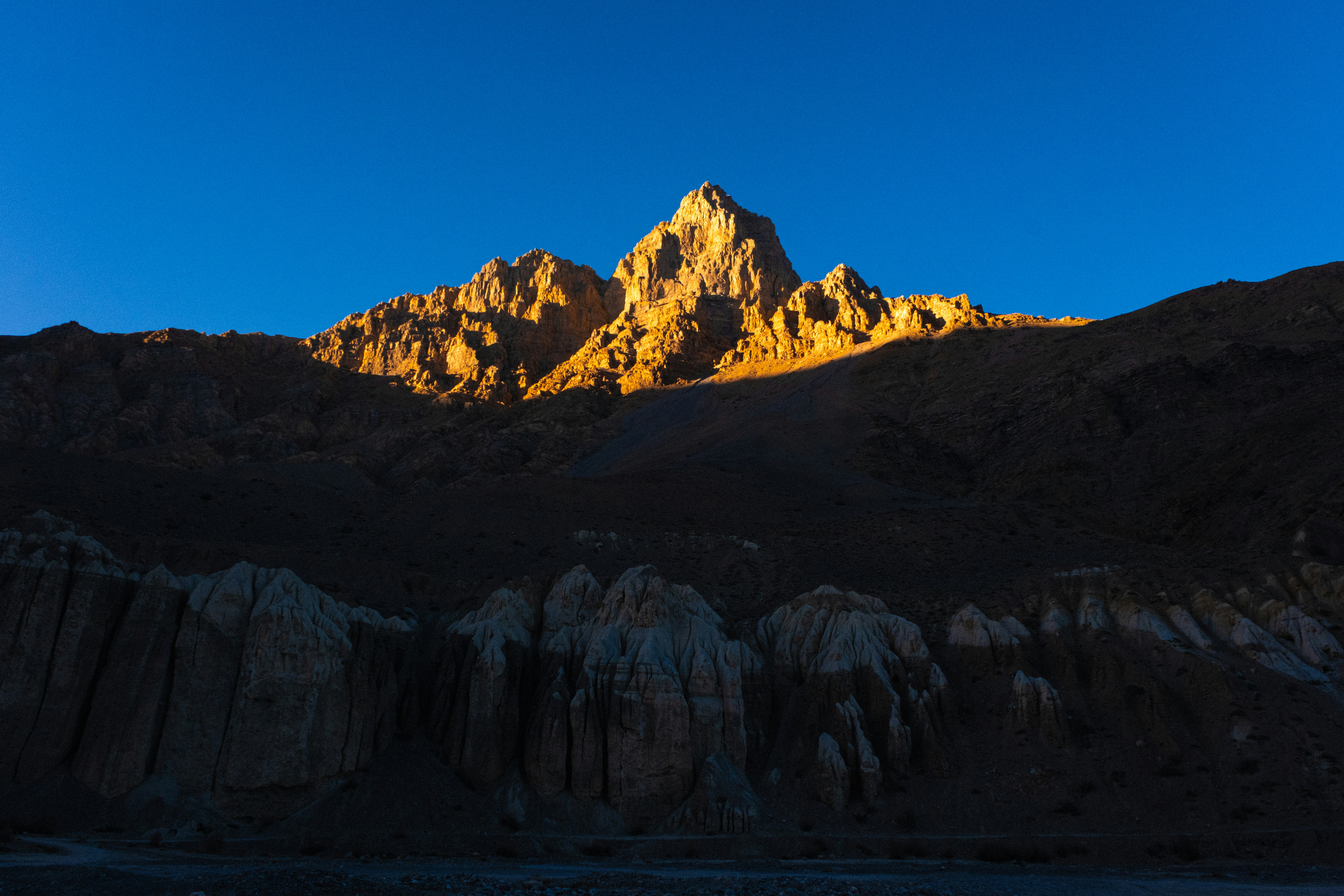 Golden Peak Crowned by a Deep Blue Sky