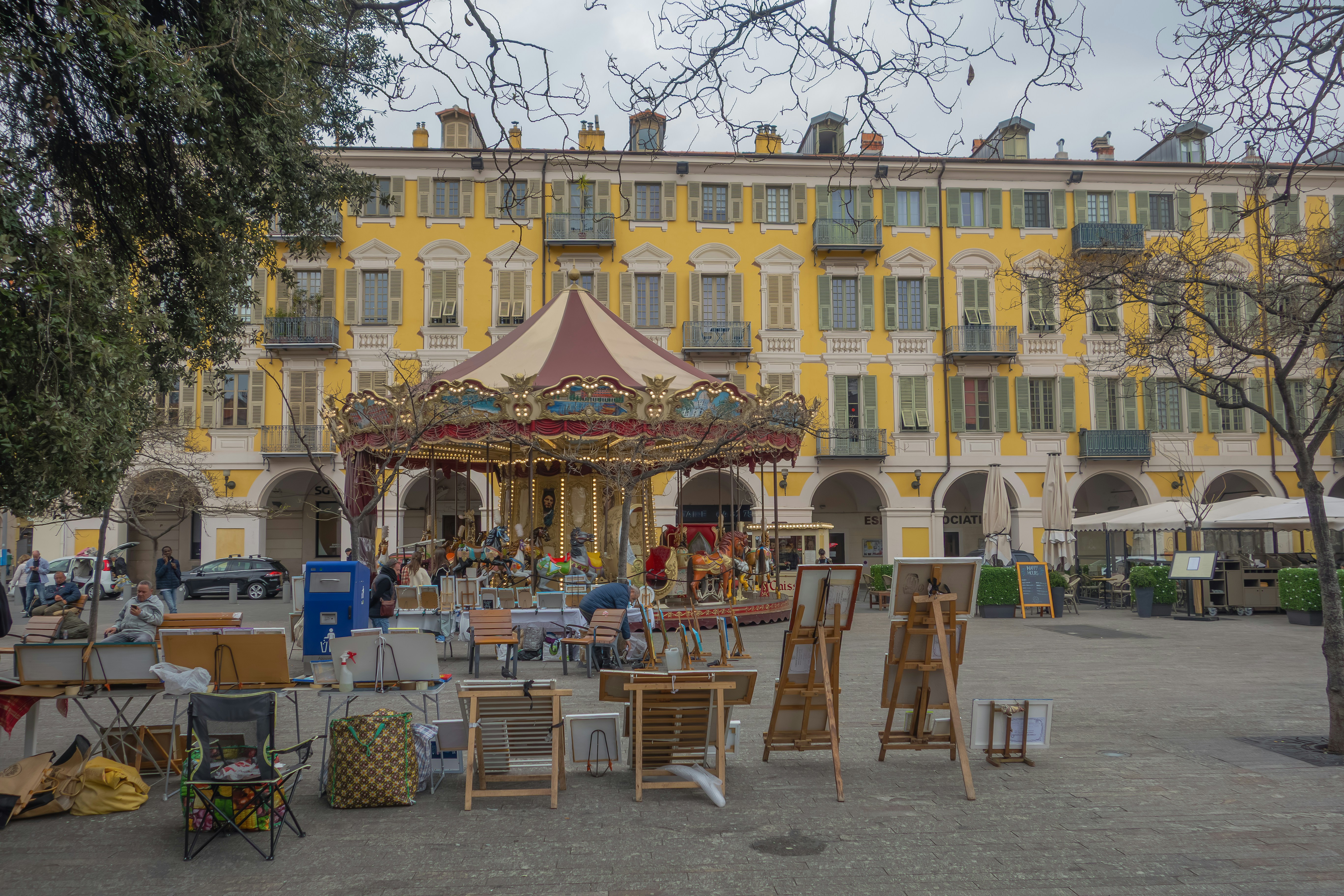 A carousel and a market in a sunny square. photo – Free France Image on ...