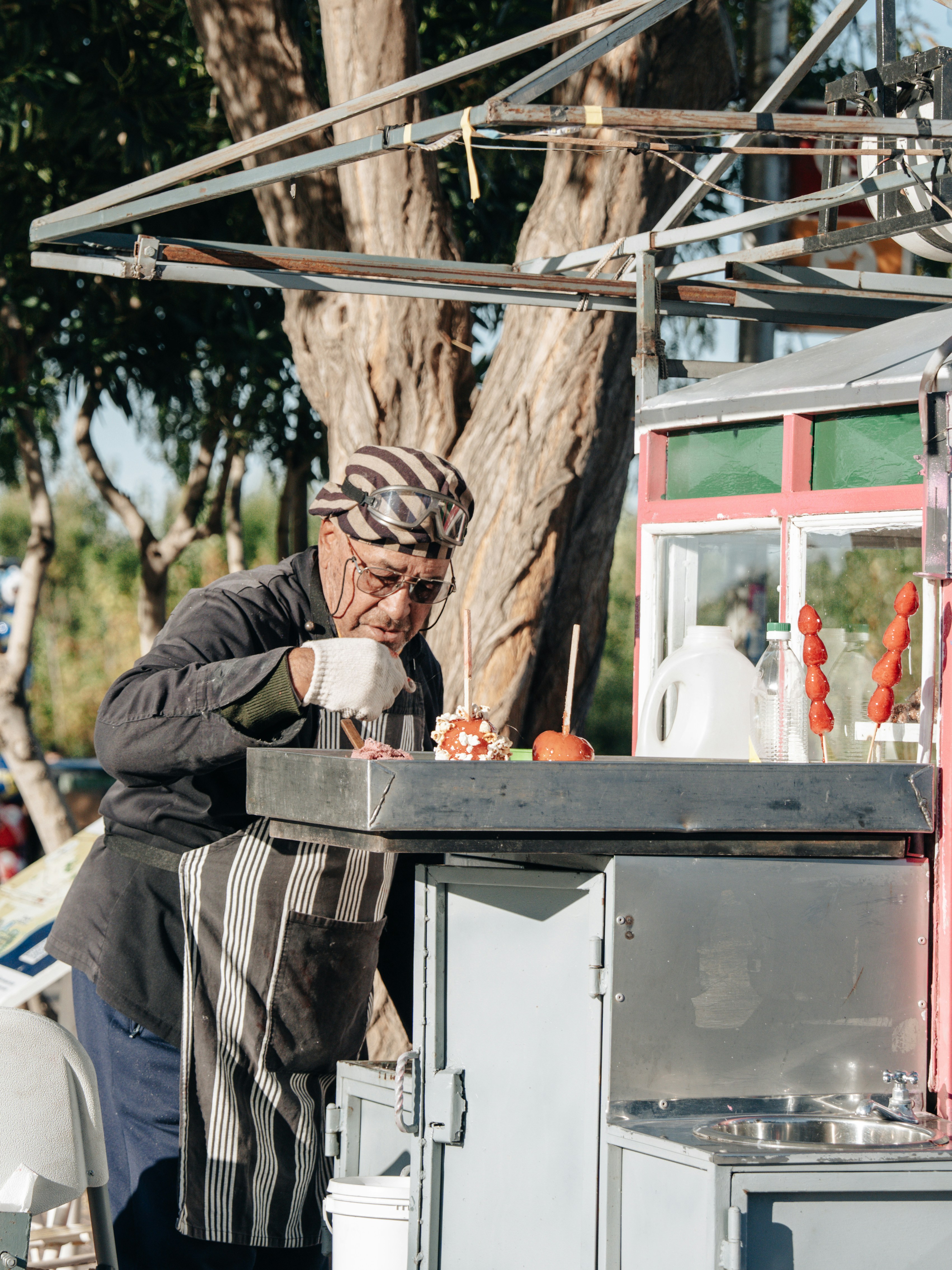 Street Vendor: Grilling Integrity and Steam as a Tiny Crowd Gathers