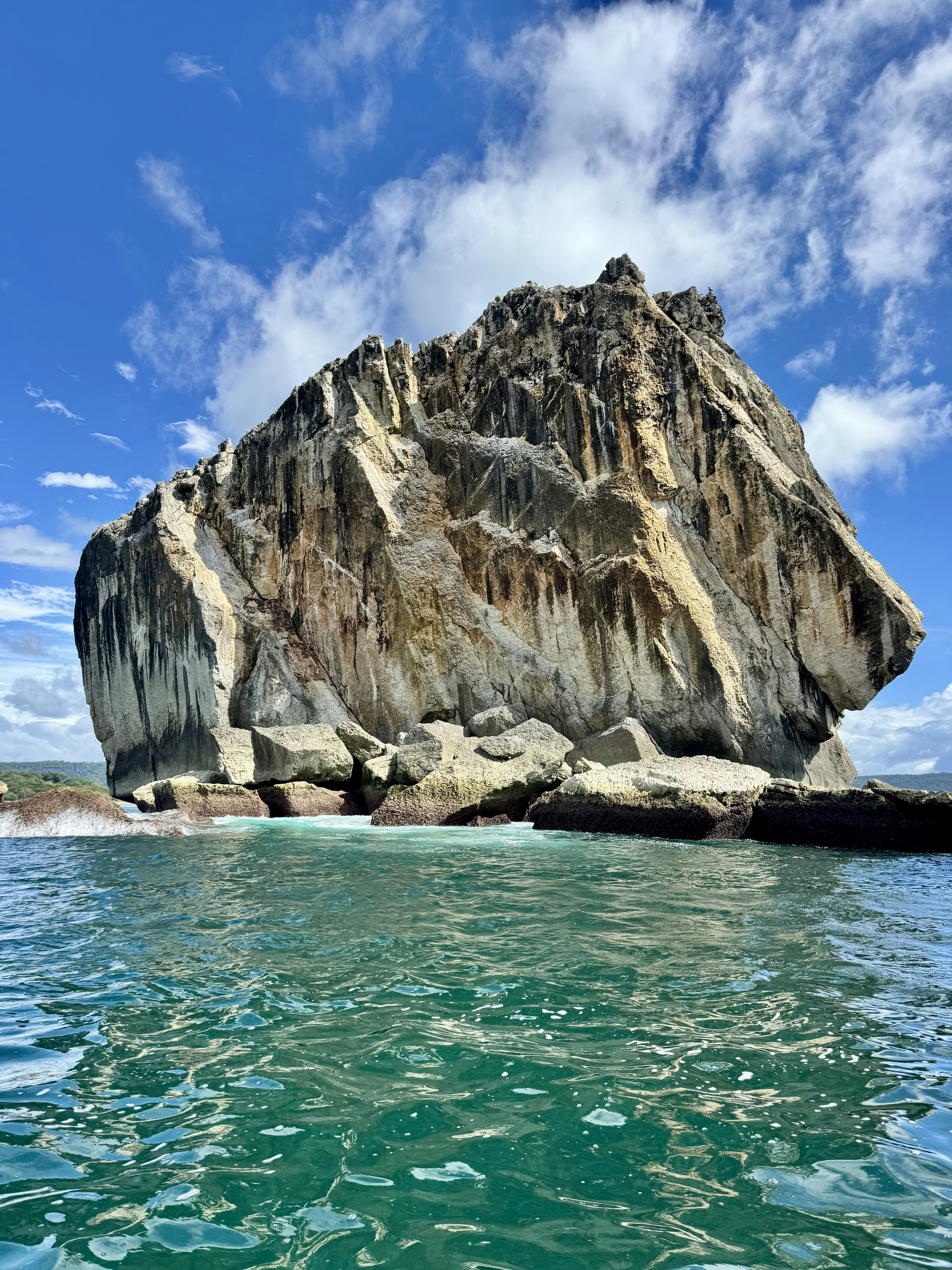 A large rock formation rises from the ocean. photo – Free Costa rica ...