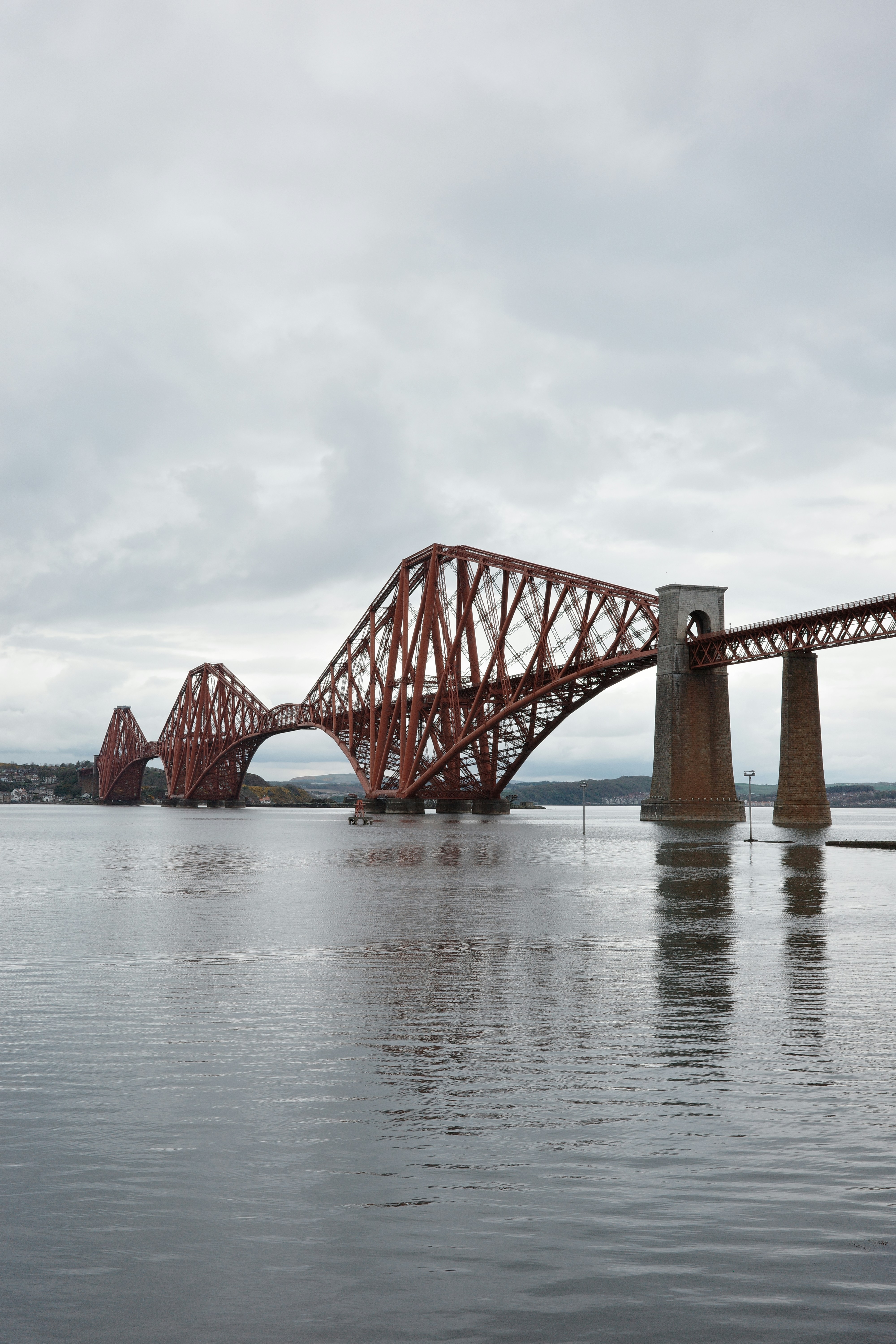 Red Arches Over a Quiet Firth: A Bridge Portrait