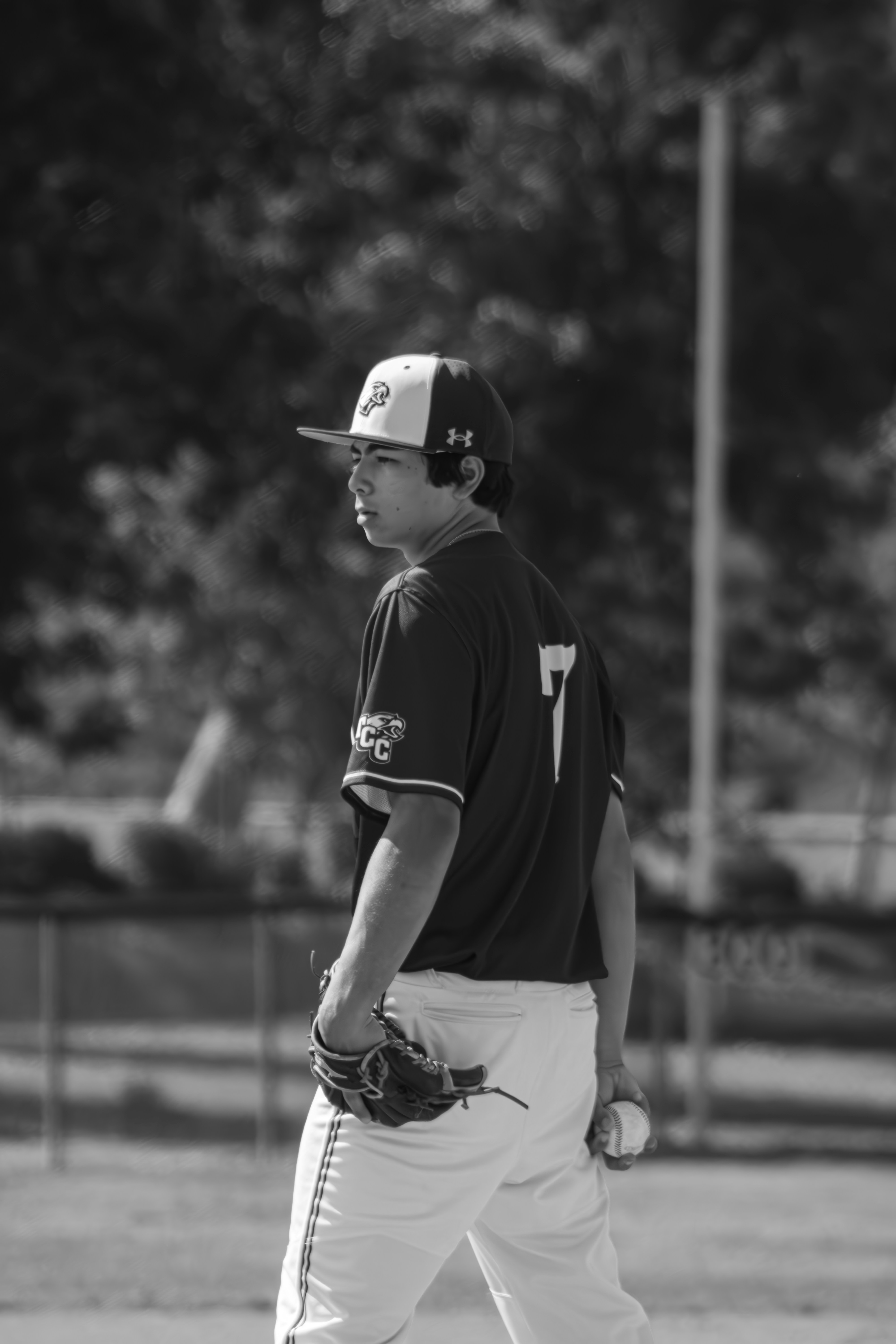Noir on the Mound: A Pitcher's Quiet Gaze in Monochrome
