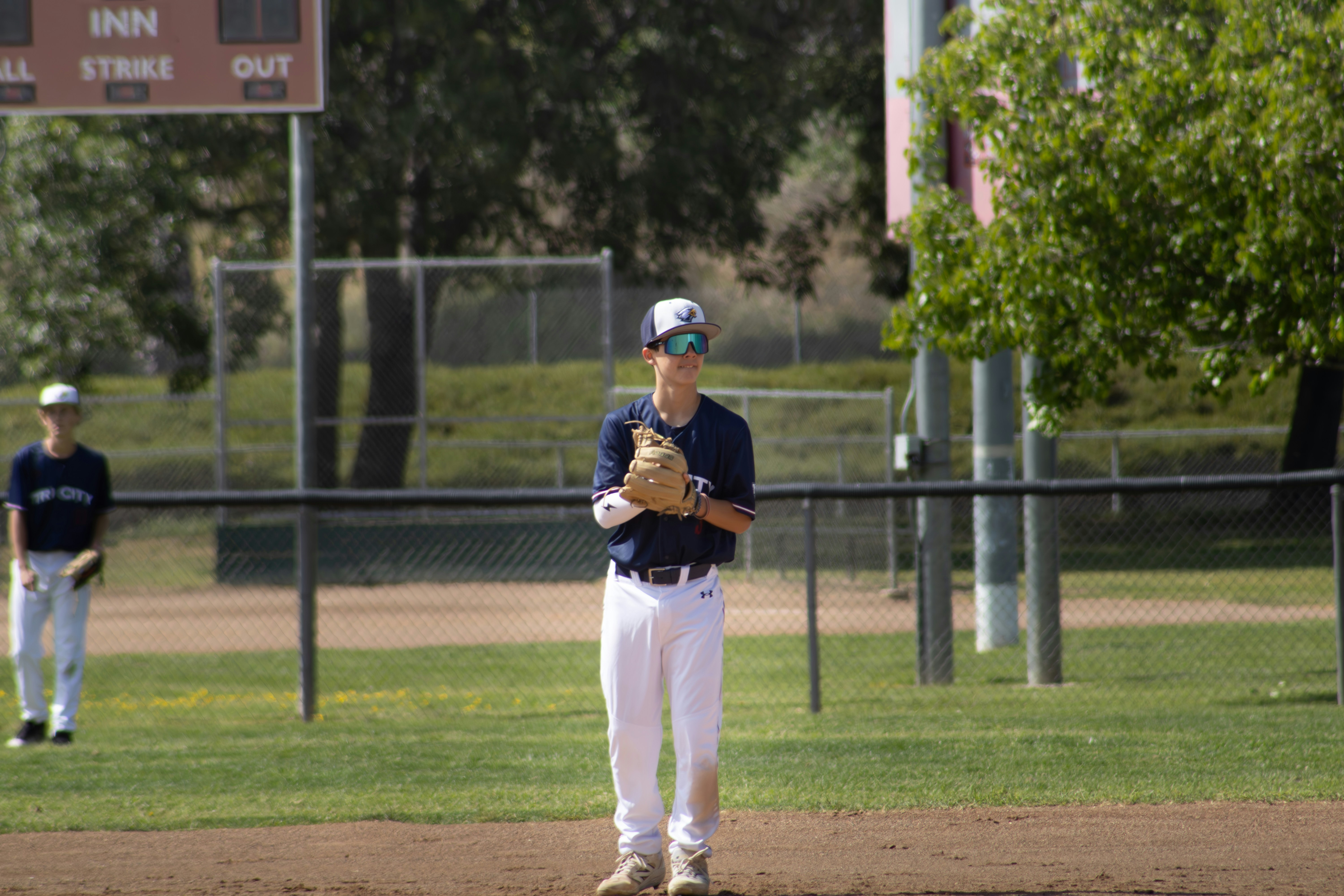 The Mound's Quiet Focus: A Pre-Pitch Moment Under Afternoon Light