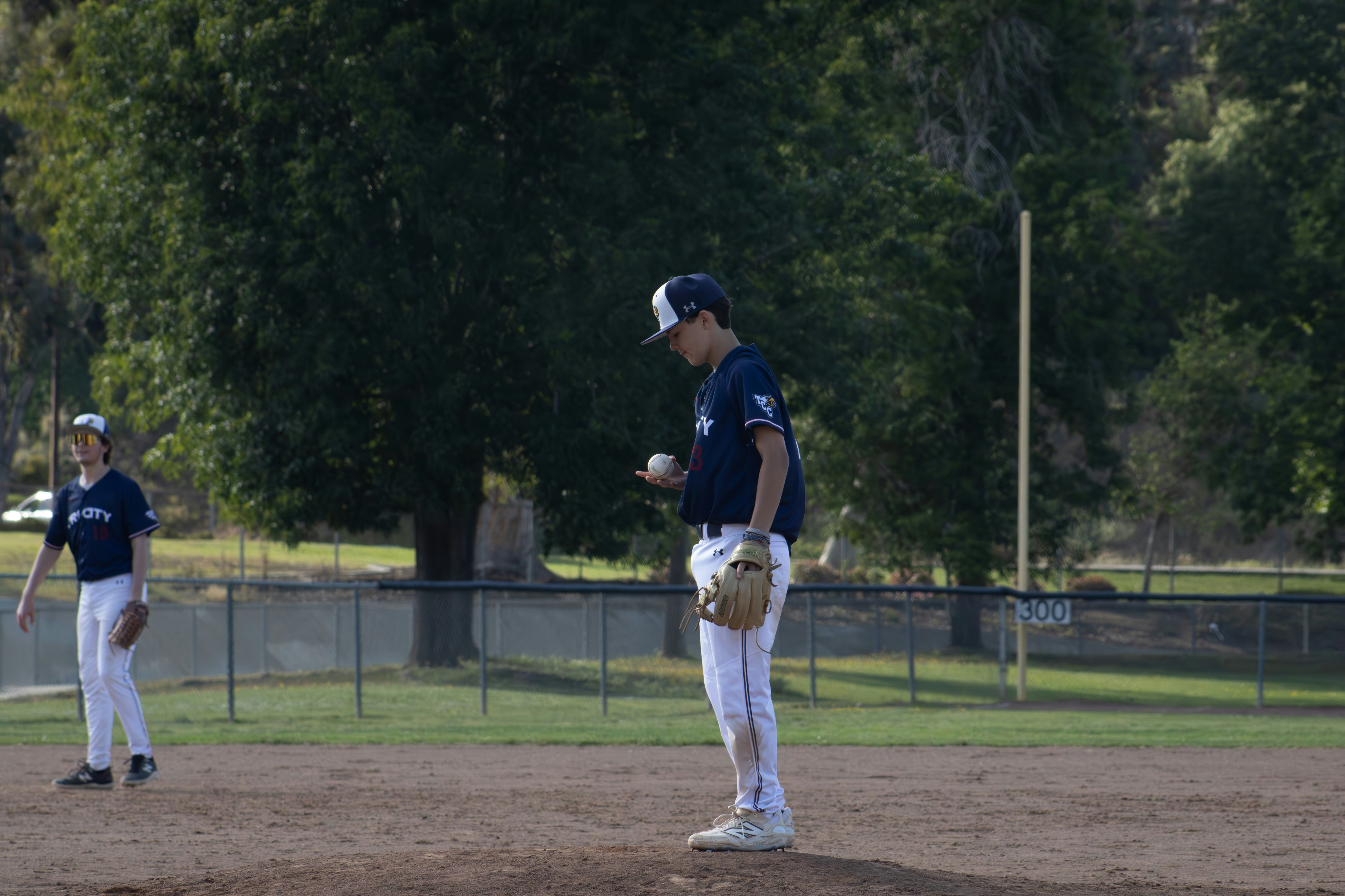 Baseball player standing on the mound, holding a ball. photo – Free Car ...