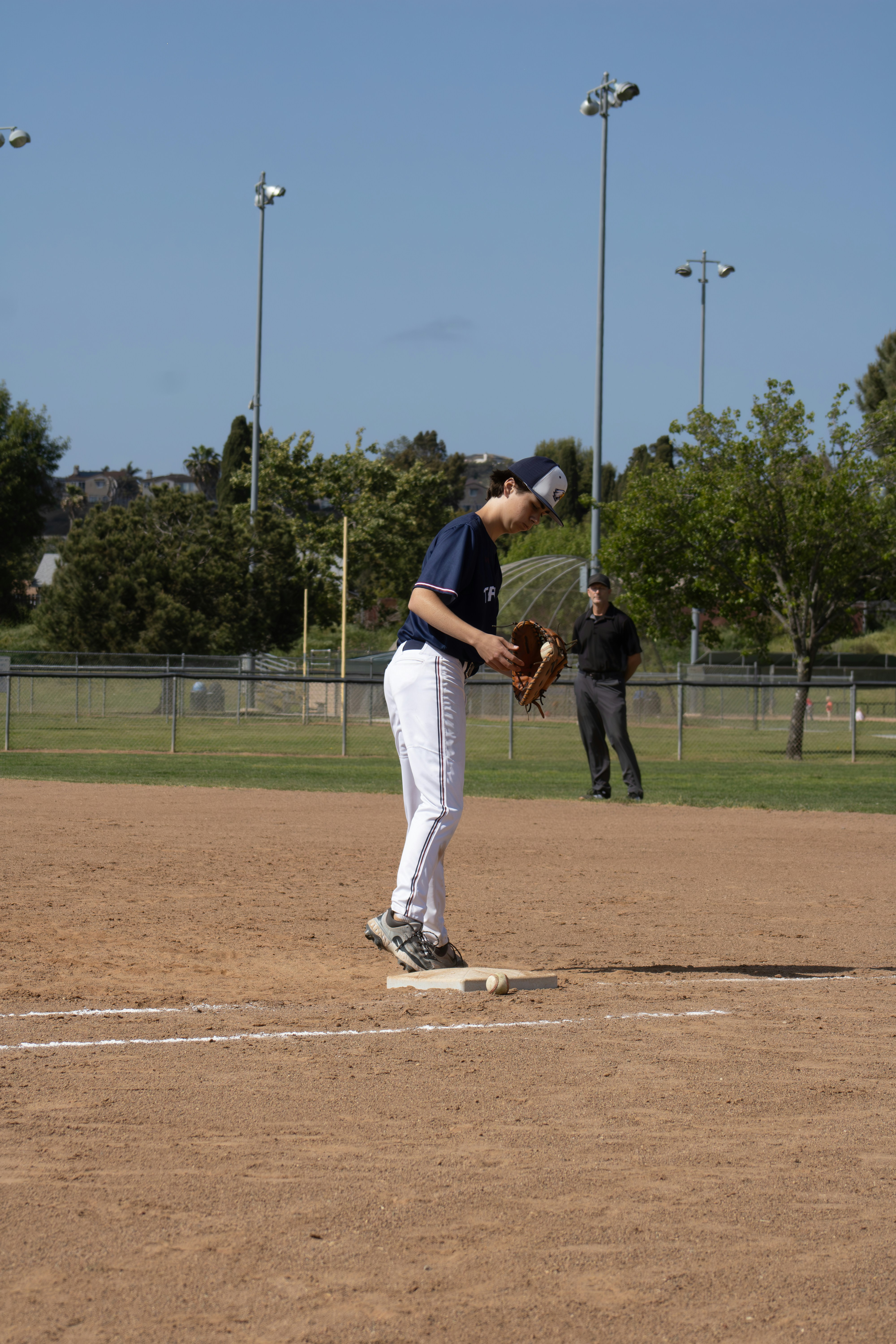A baseball player stands on the pitcher's mound. photo – Free Image on ...