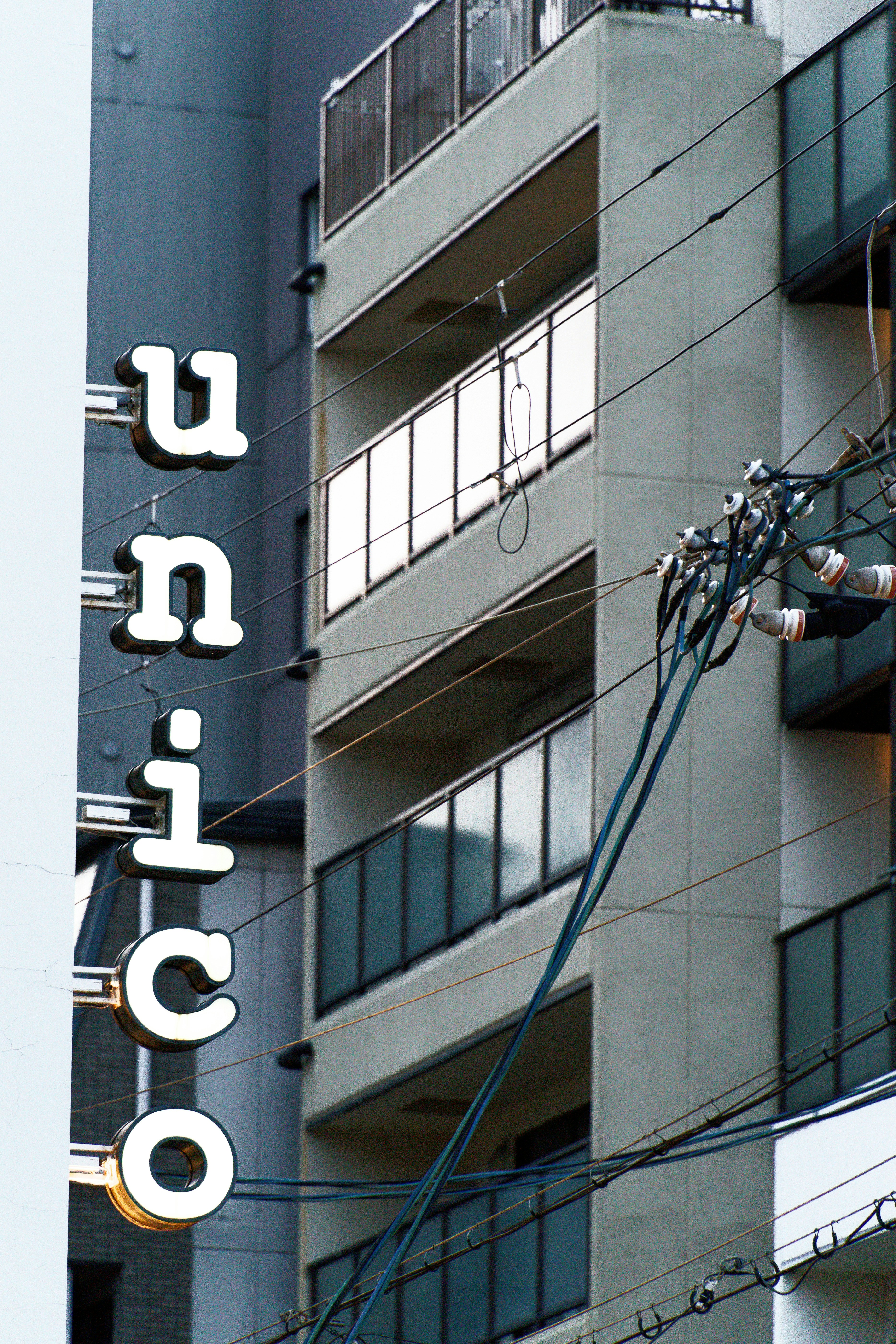 An illuminated sign and a building are visible. photo – Free Image on ...