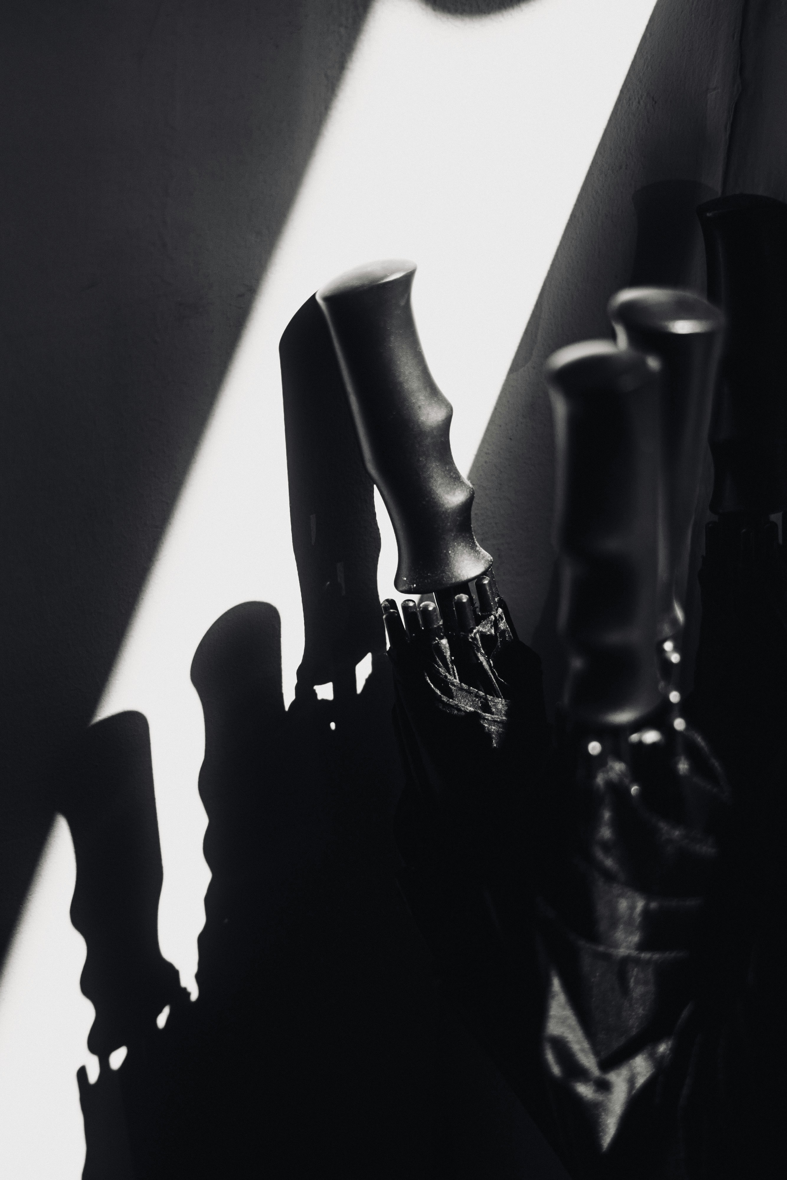 Shadows of Resilience: Umbrellas in Monochrome