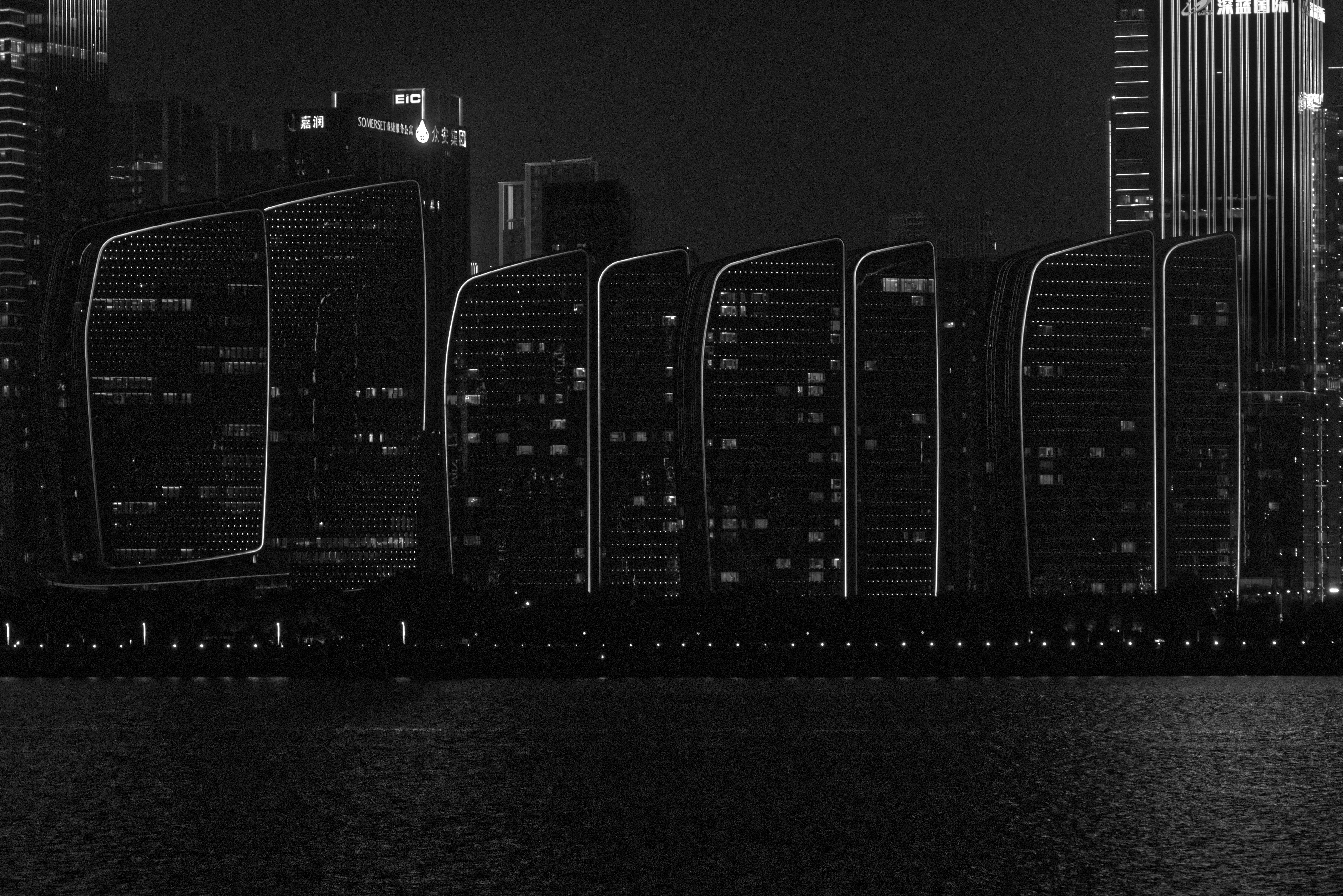 Nocturnal Arcs Over the River: The Crowned Skyline
