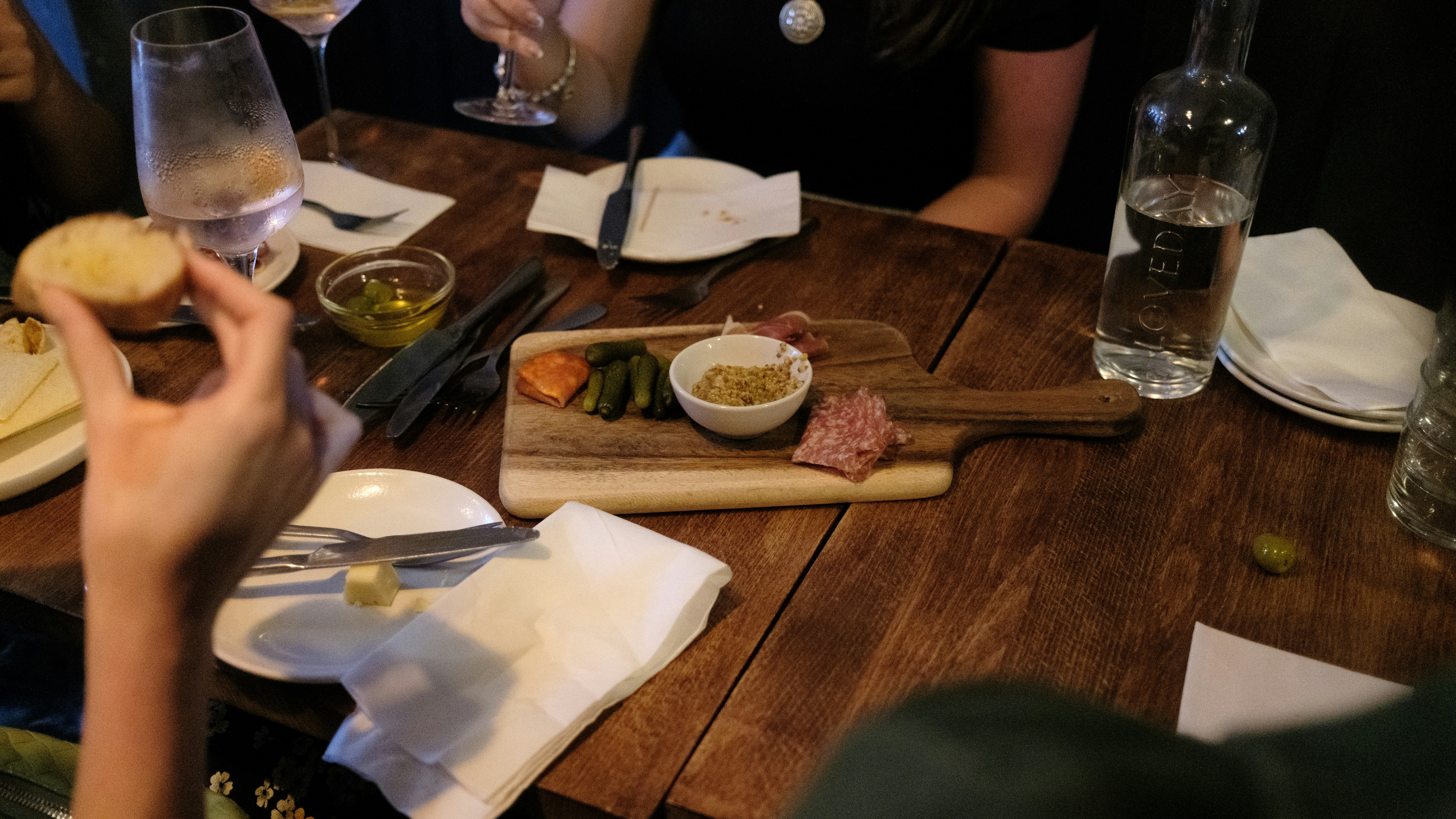 People enjoy snacks and drinks at a restaurant. photo – Free Wallpaper ...