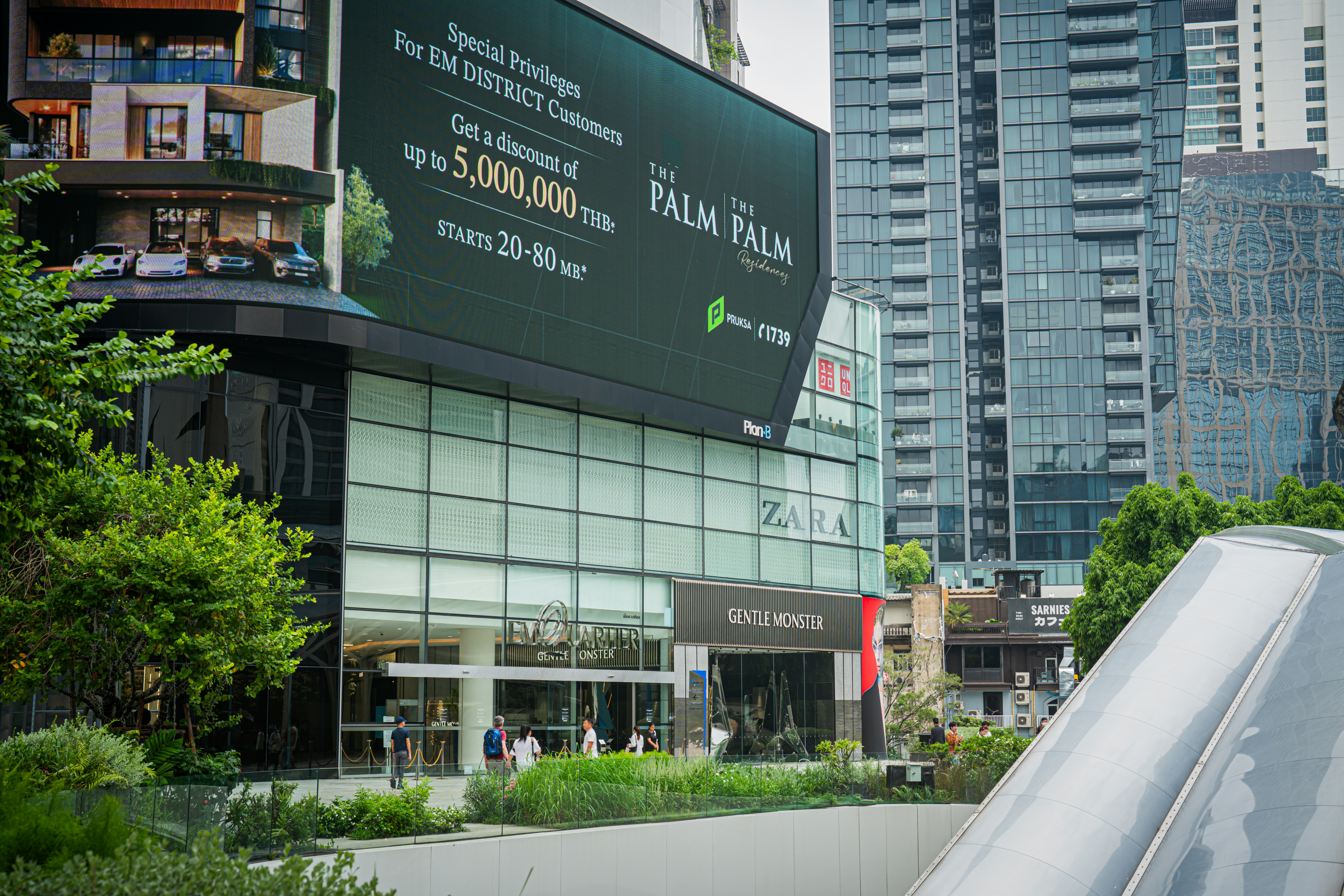 Green Billboard Over a Zara-Gentle Monster Corridor