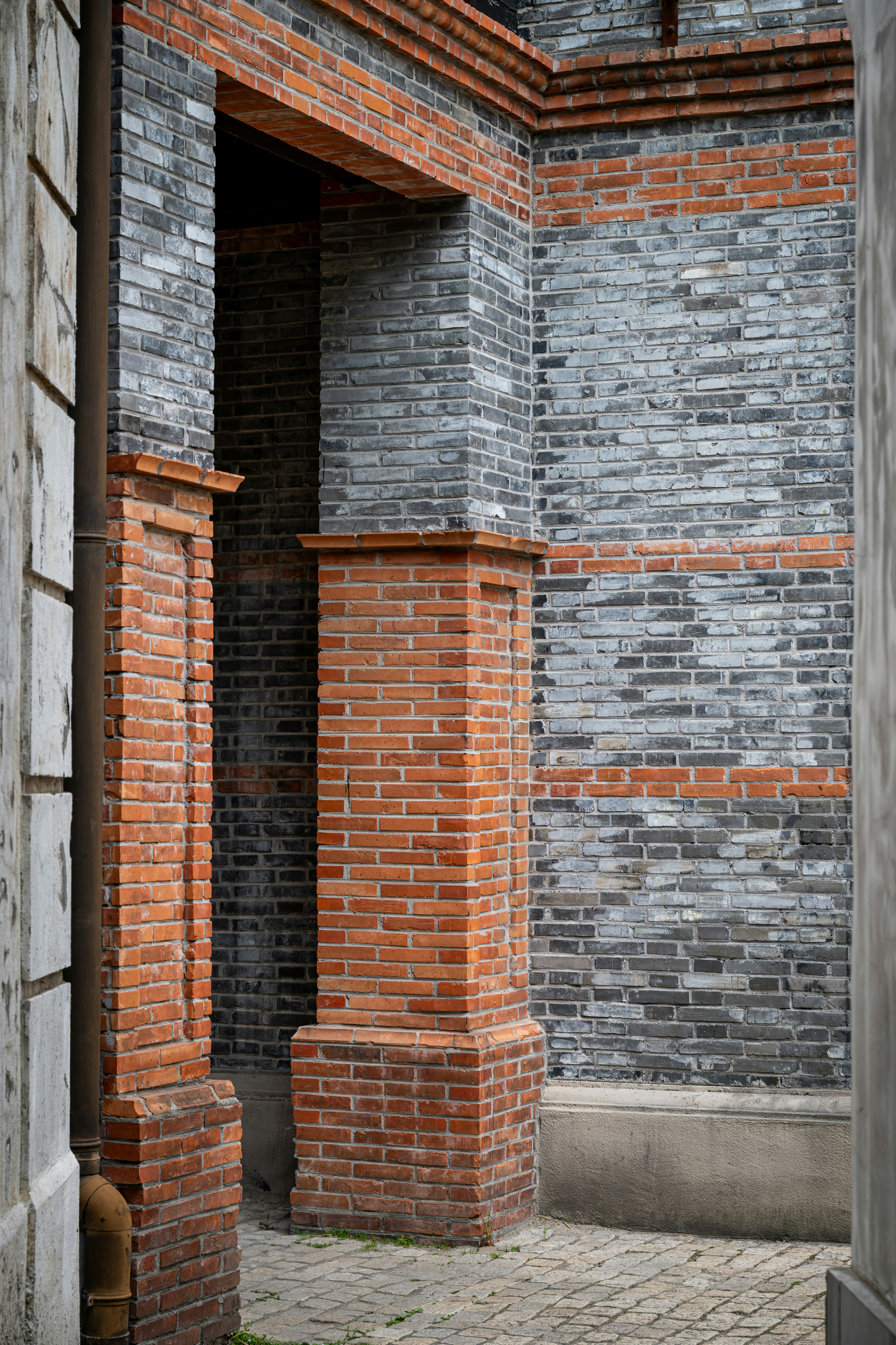 Brick Archway Framing a Quiet Corner