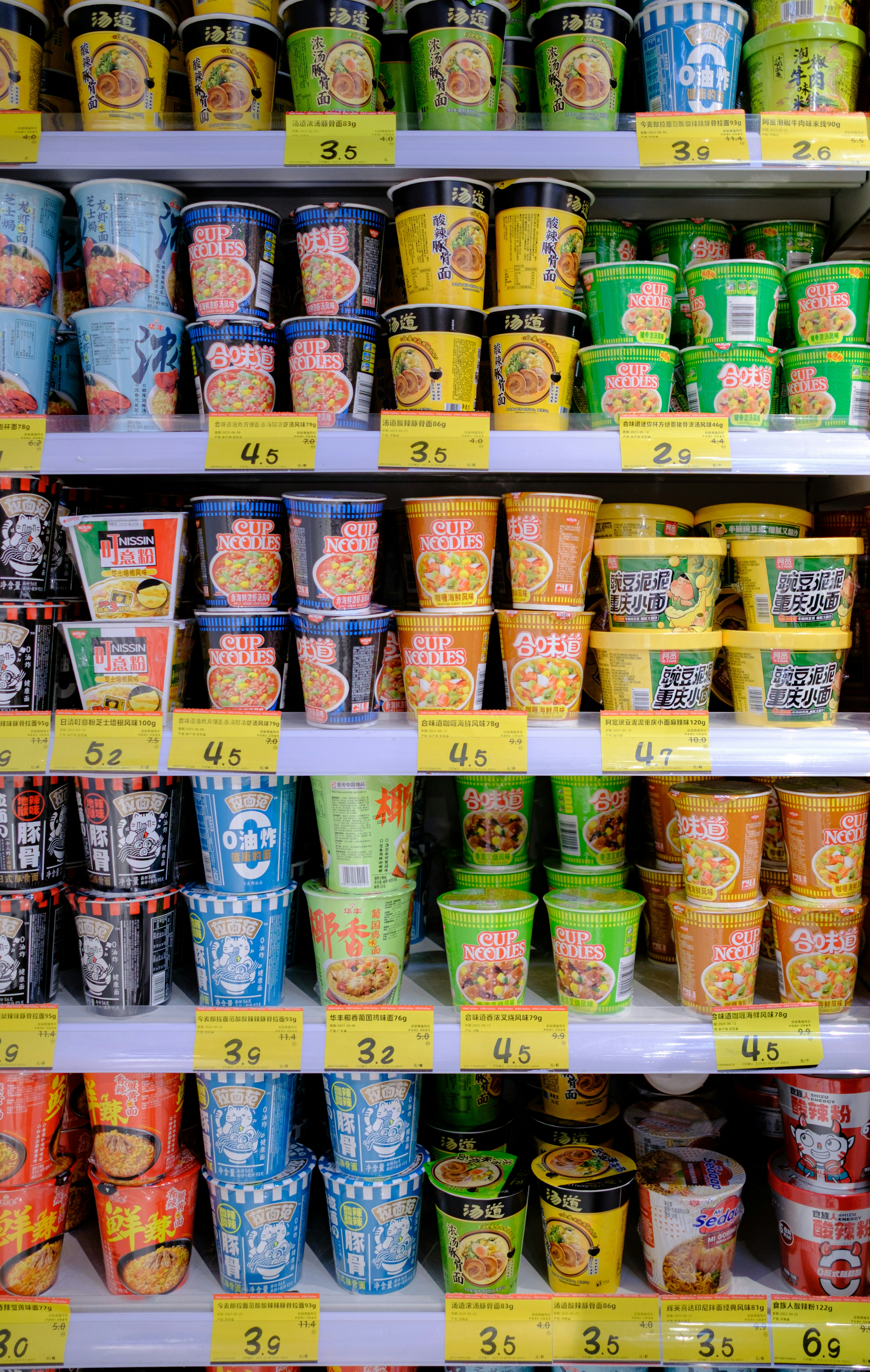 Neon Cup Noodles Parade Across a Grocery Shelf