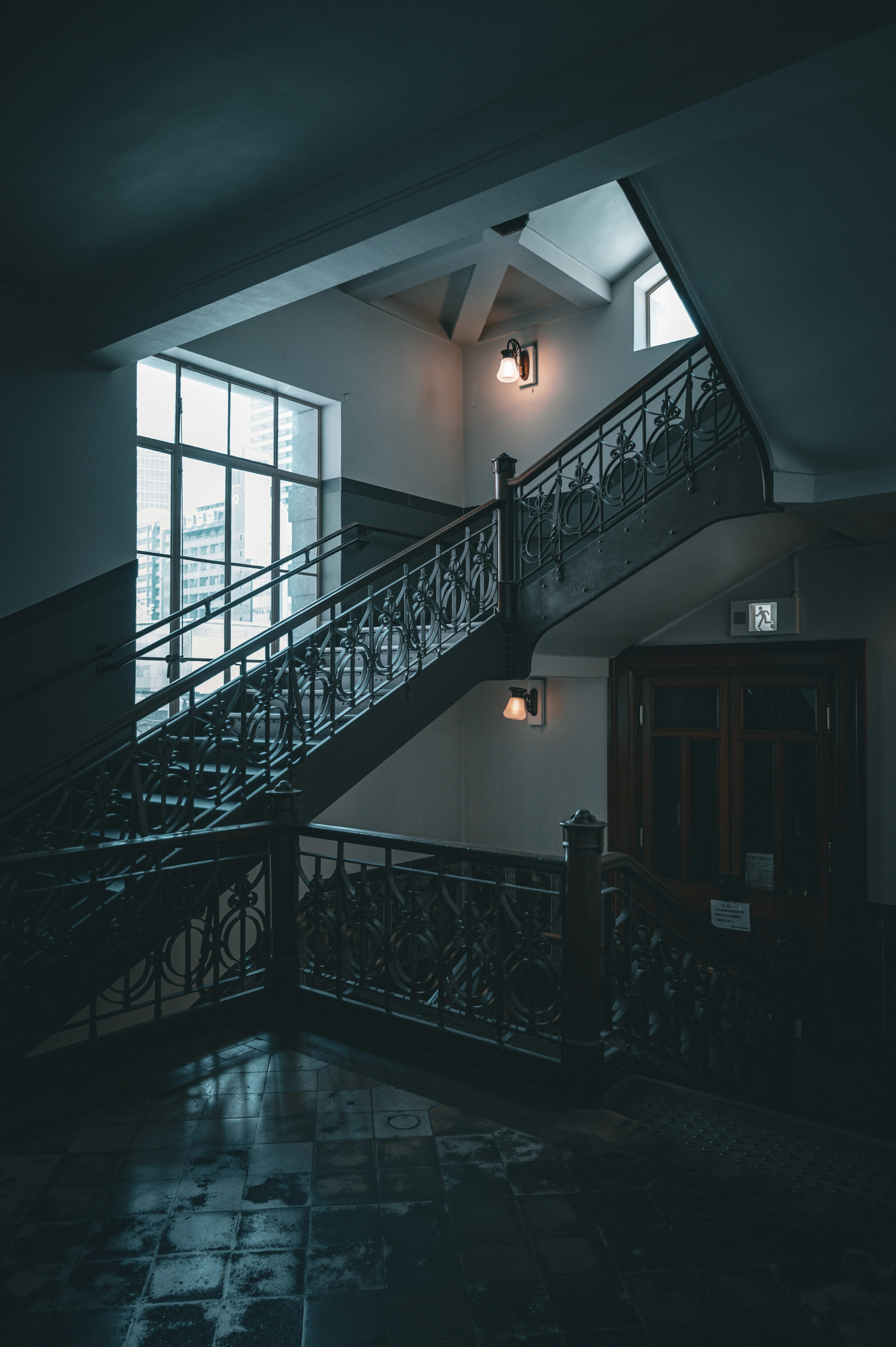 An elegant staircase inside a dimly lit building. photo – Free Image on ...