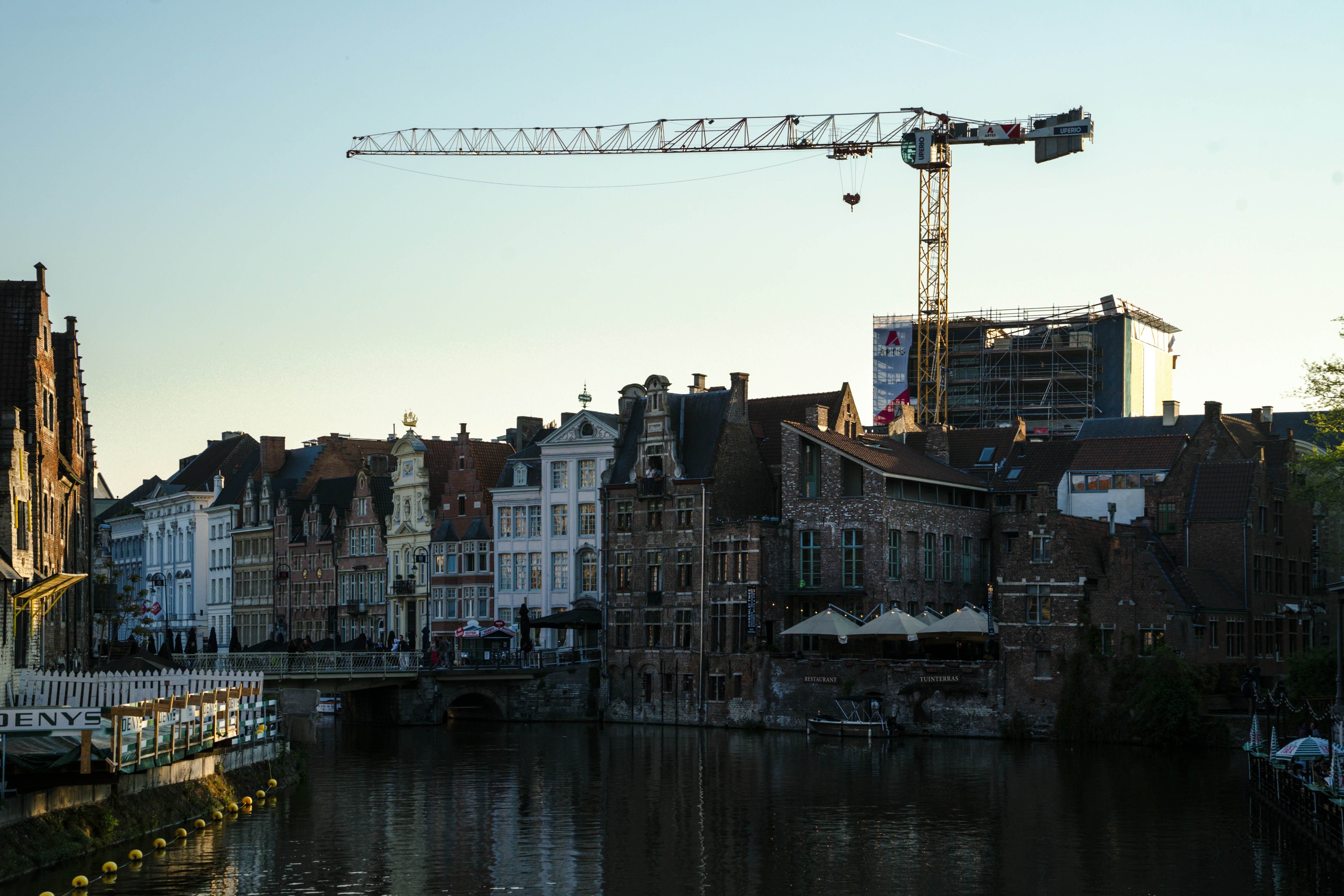 Crane over the Meuse: Riverside Gabled Charm at Dusk