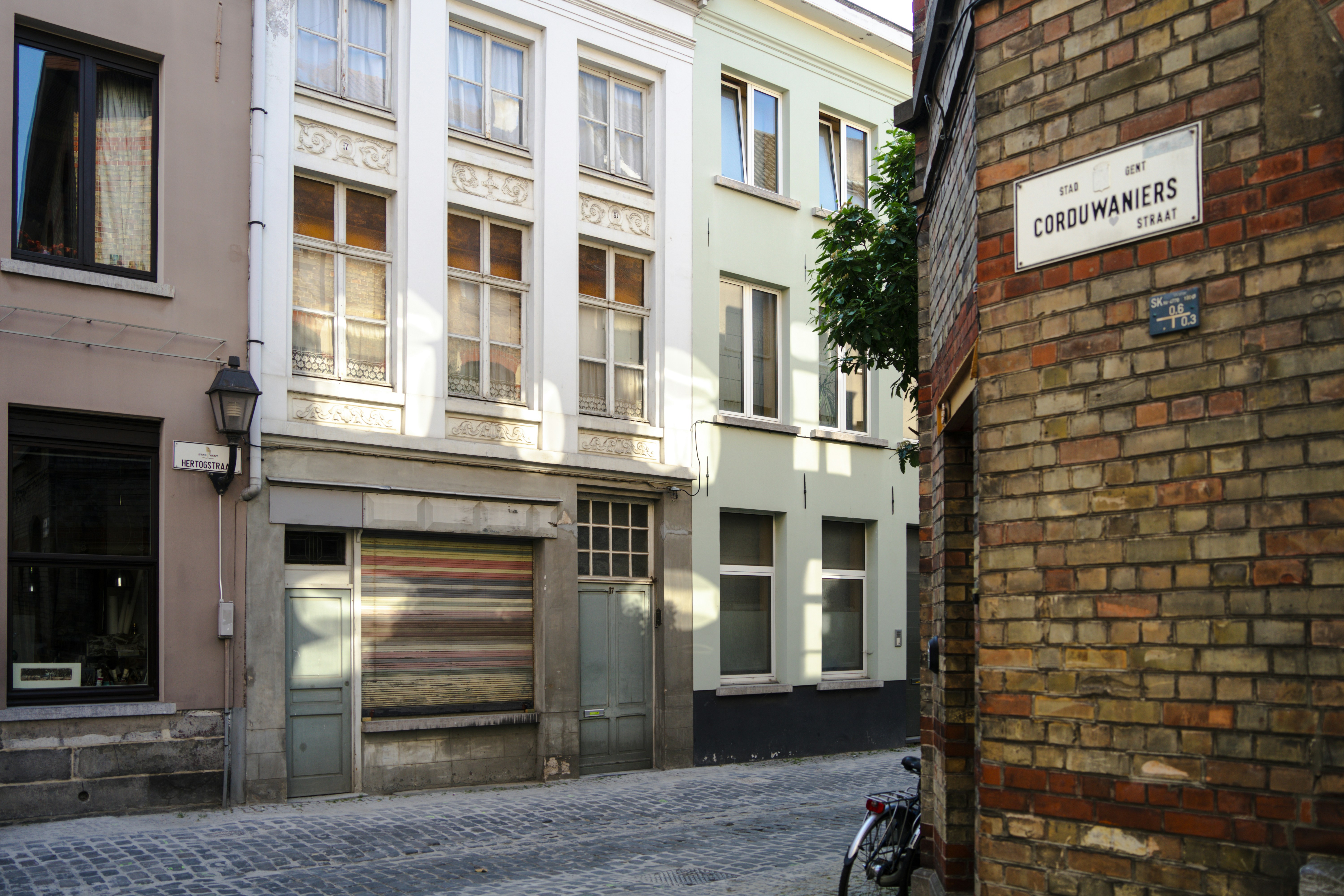 Quaint buildings line a cobbled street in europe. photo – Free Travel ...
