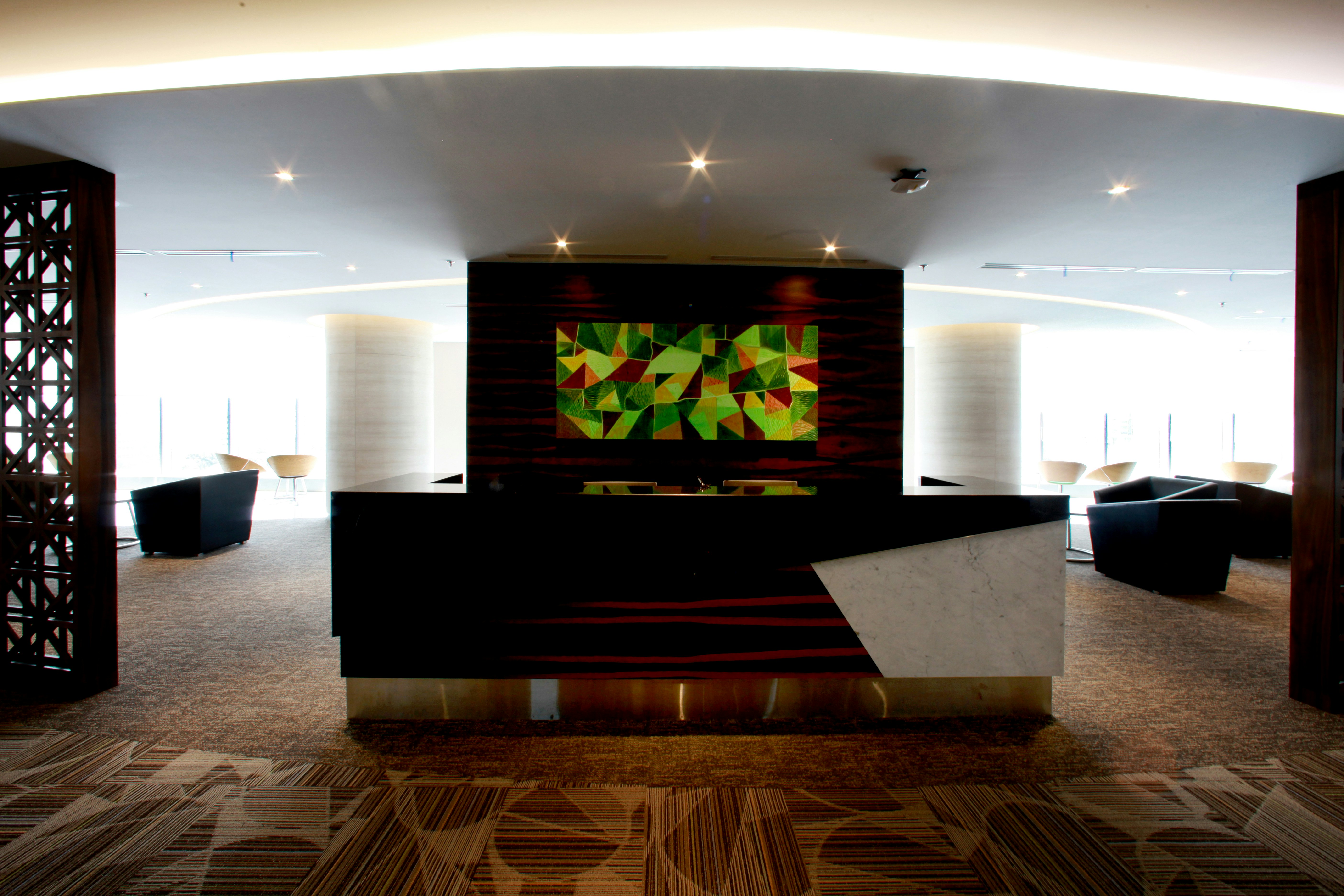 A modern lobby with reception desk and waiting area. photo – Free Image ...