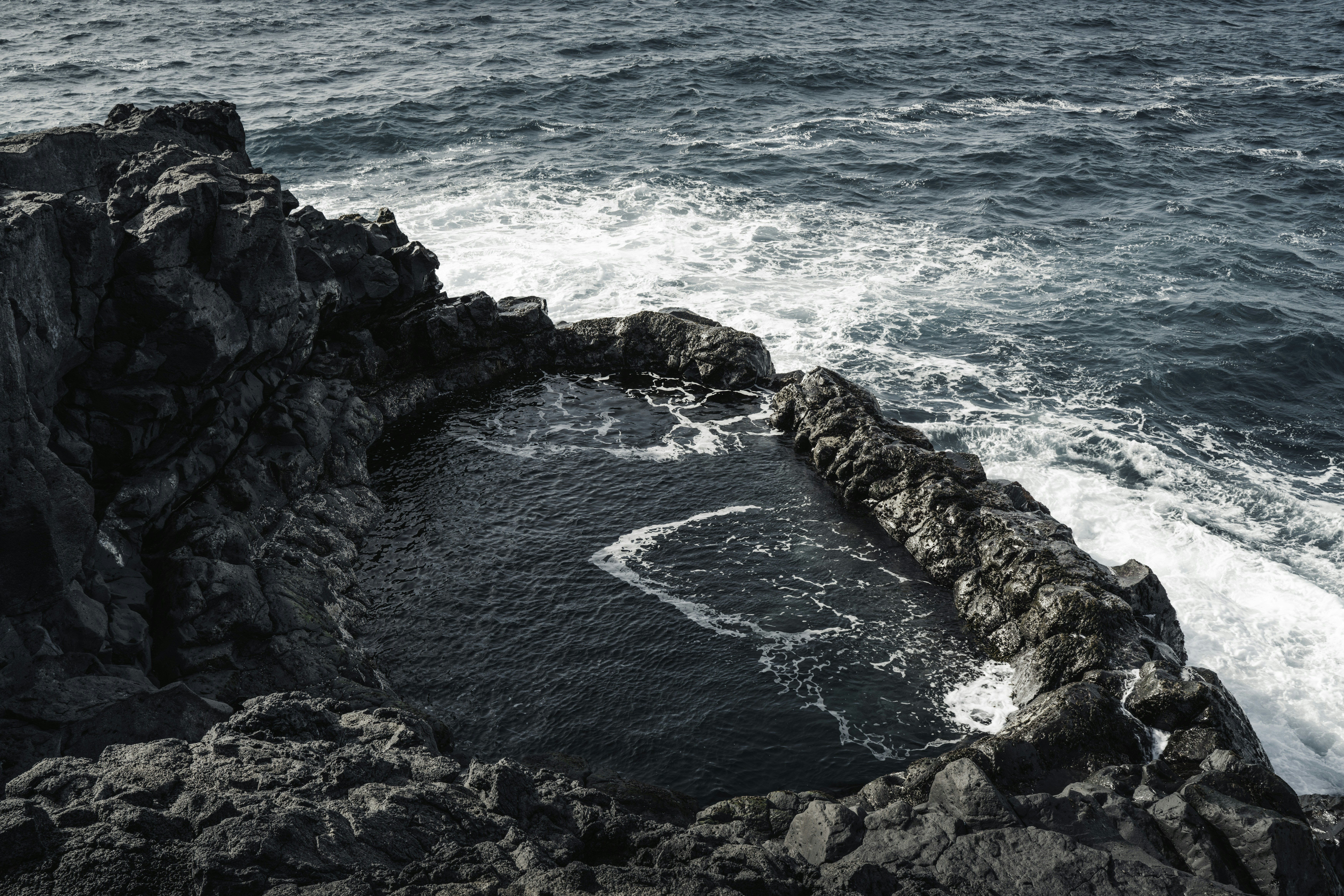 Rocky coastline with a natural tidal pool.