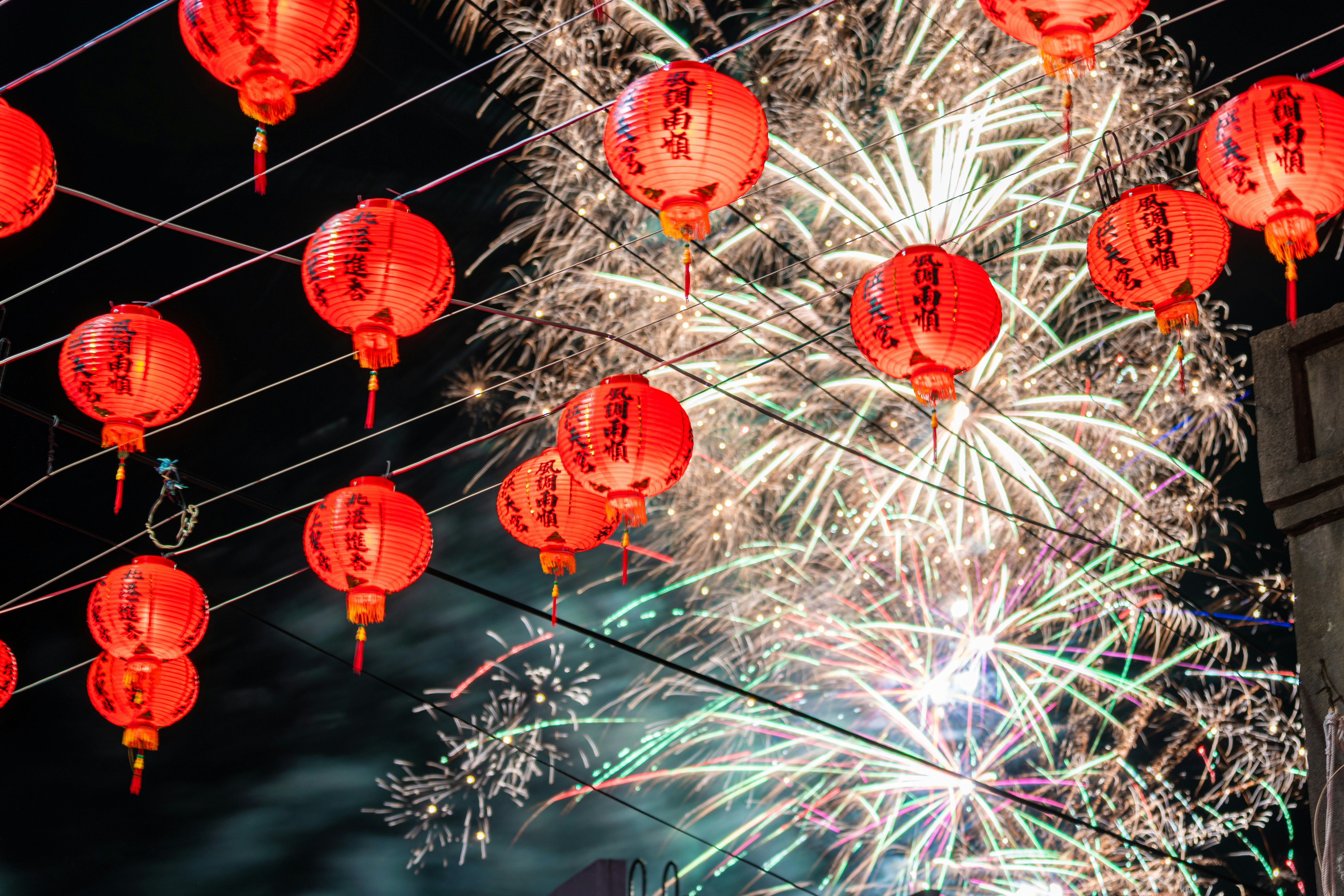 Red lanterns and fireworks light up the night. photo – Free Fireworks ...