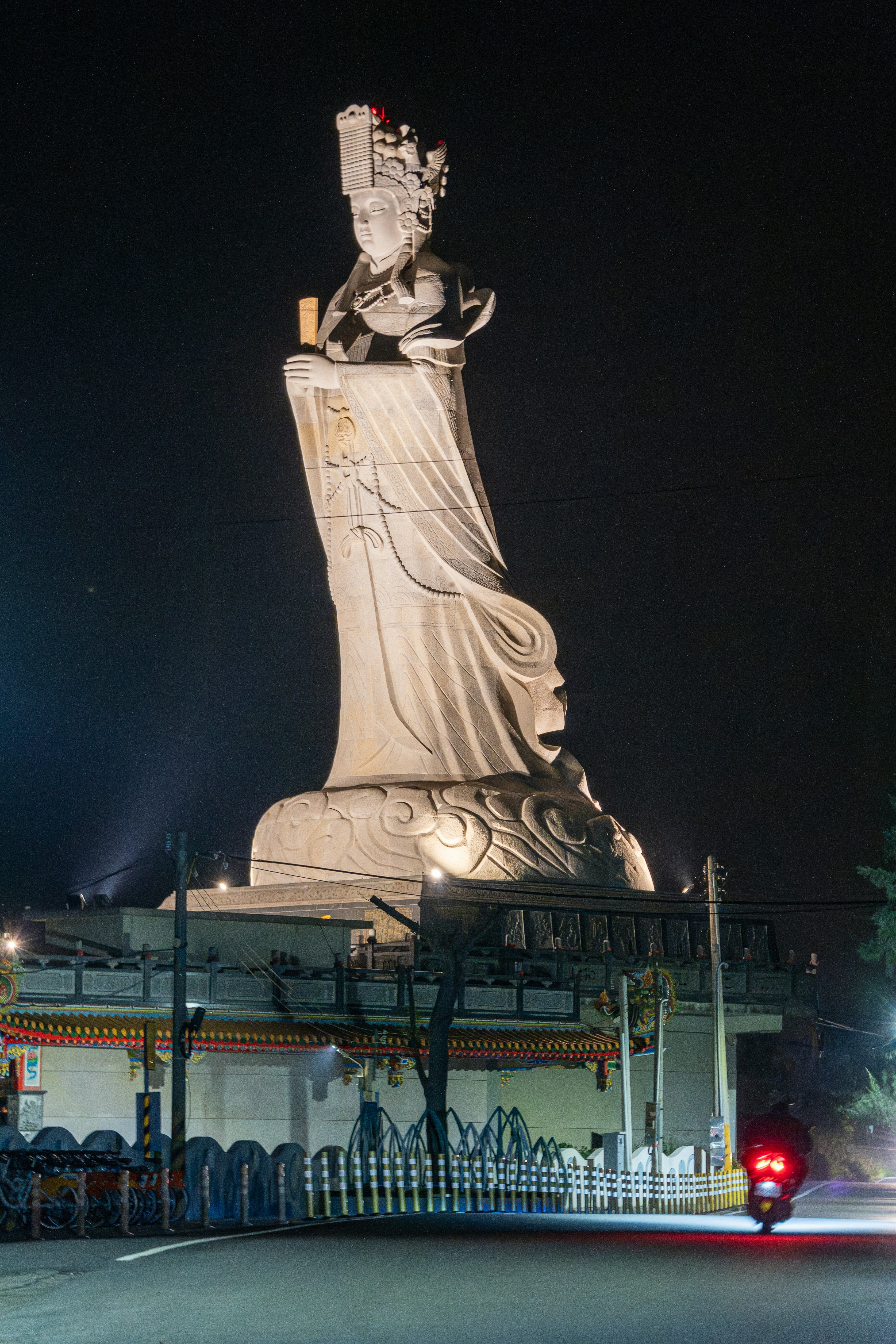 Crowned Sentinel Over a Quiet Shrine at Night