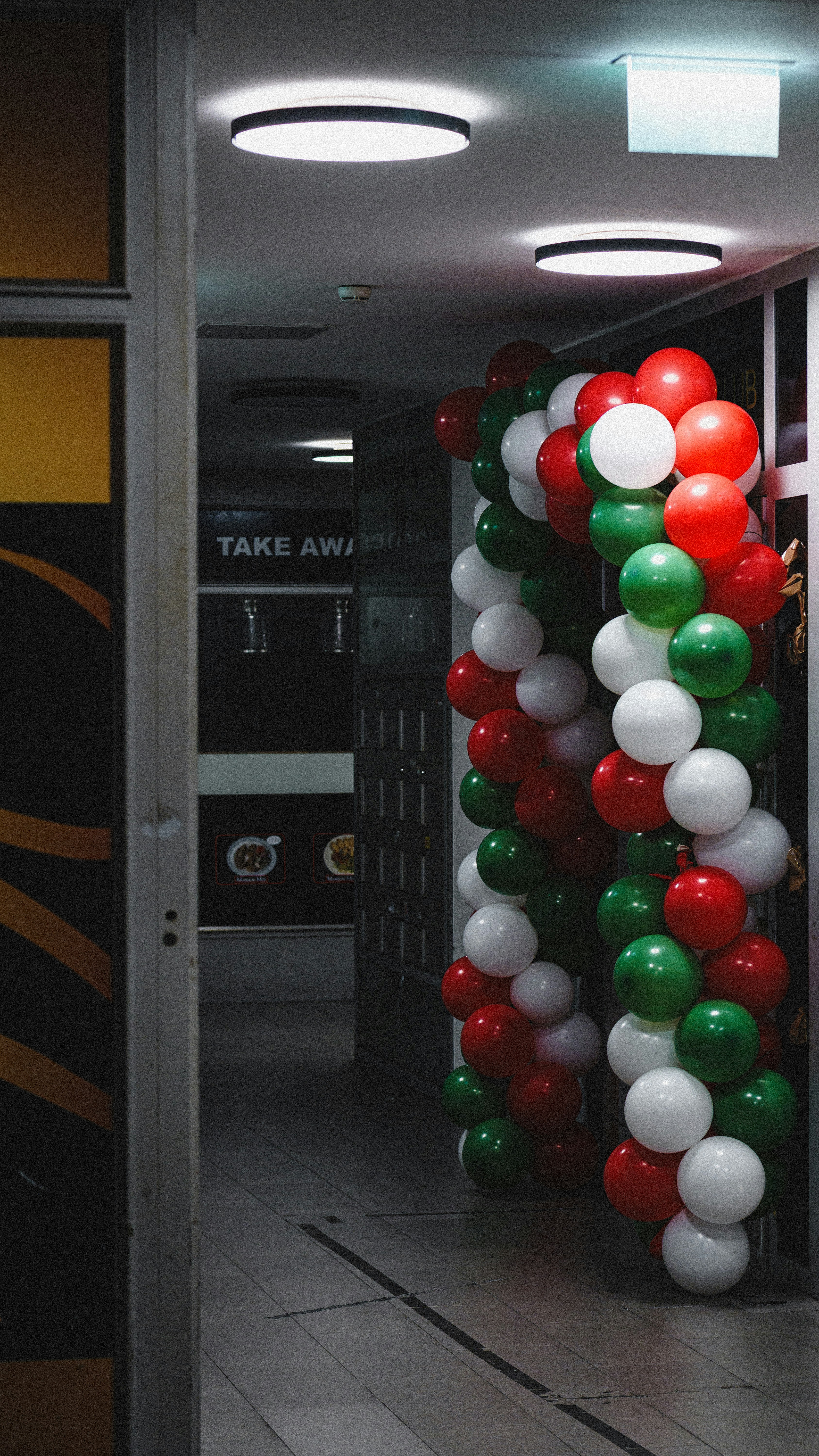 Balloon Archway Framing a Dim Corridor