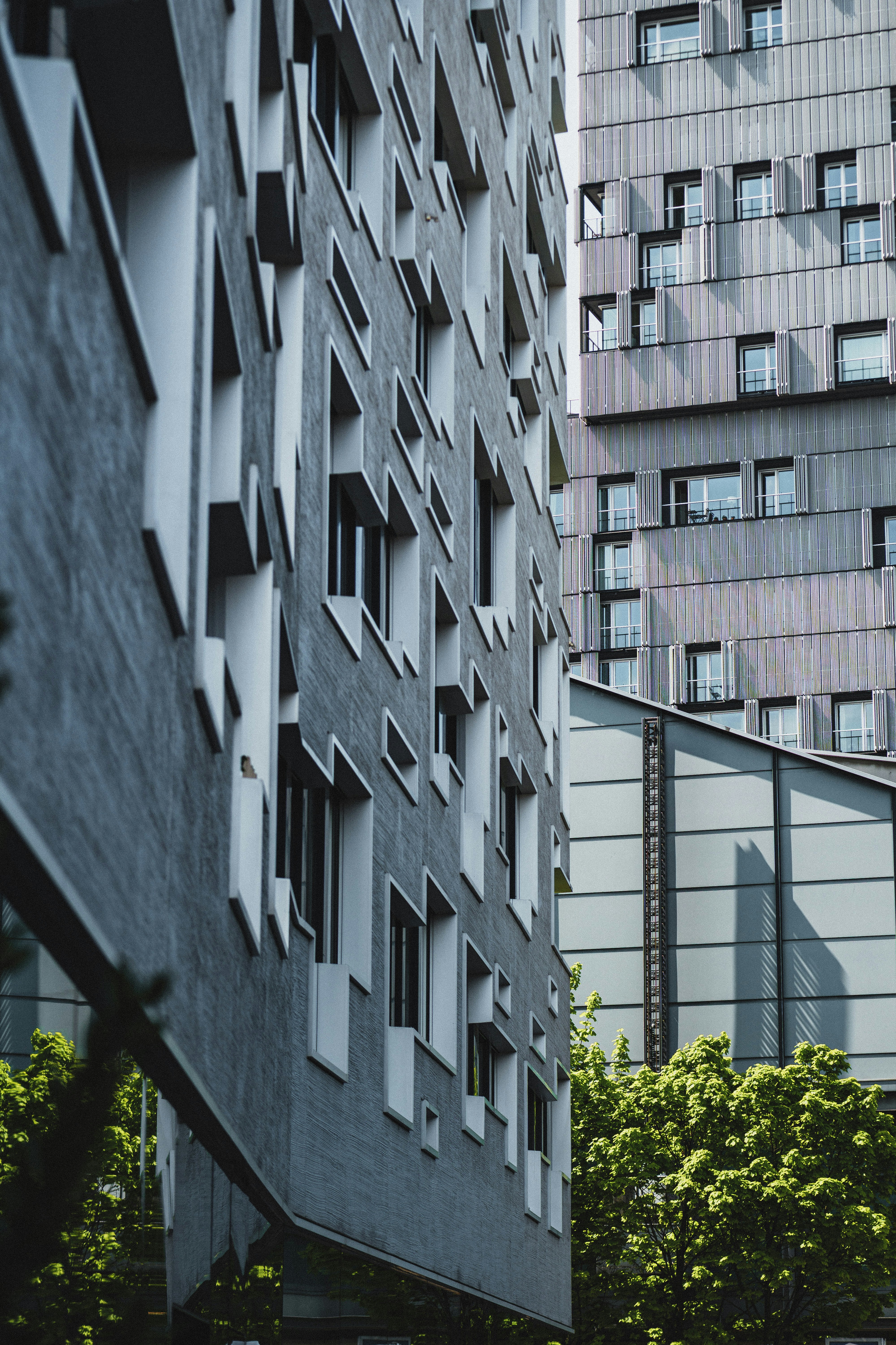 Modern buildings with unique window designs are shown. photo – Free ...