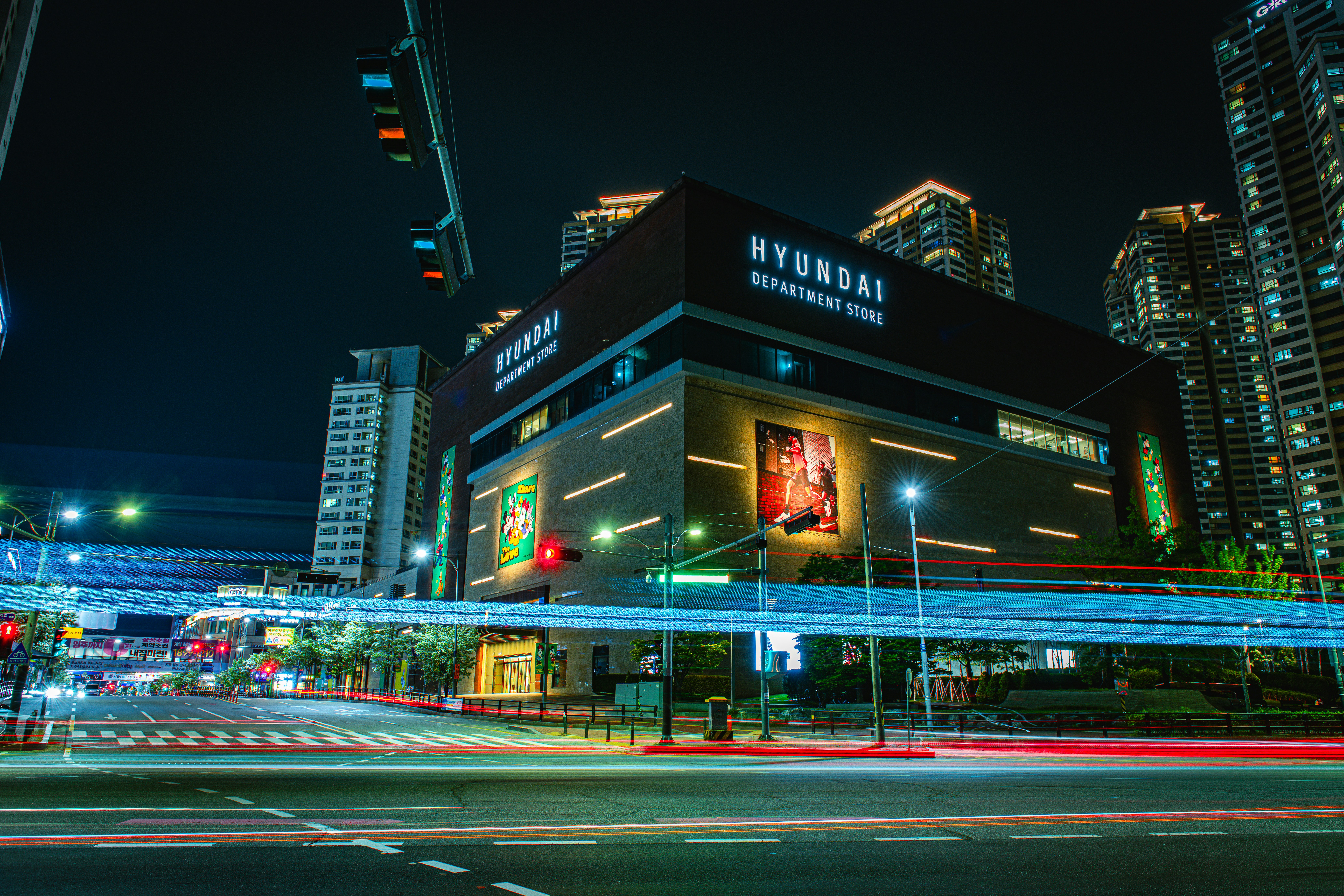 Neon Facade Pulse: Hyundai Department Store Under City Lights