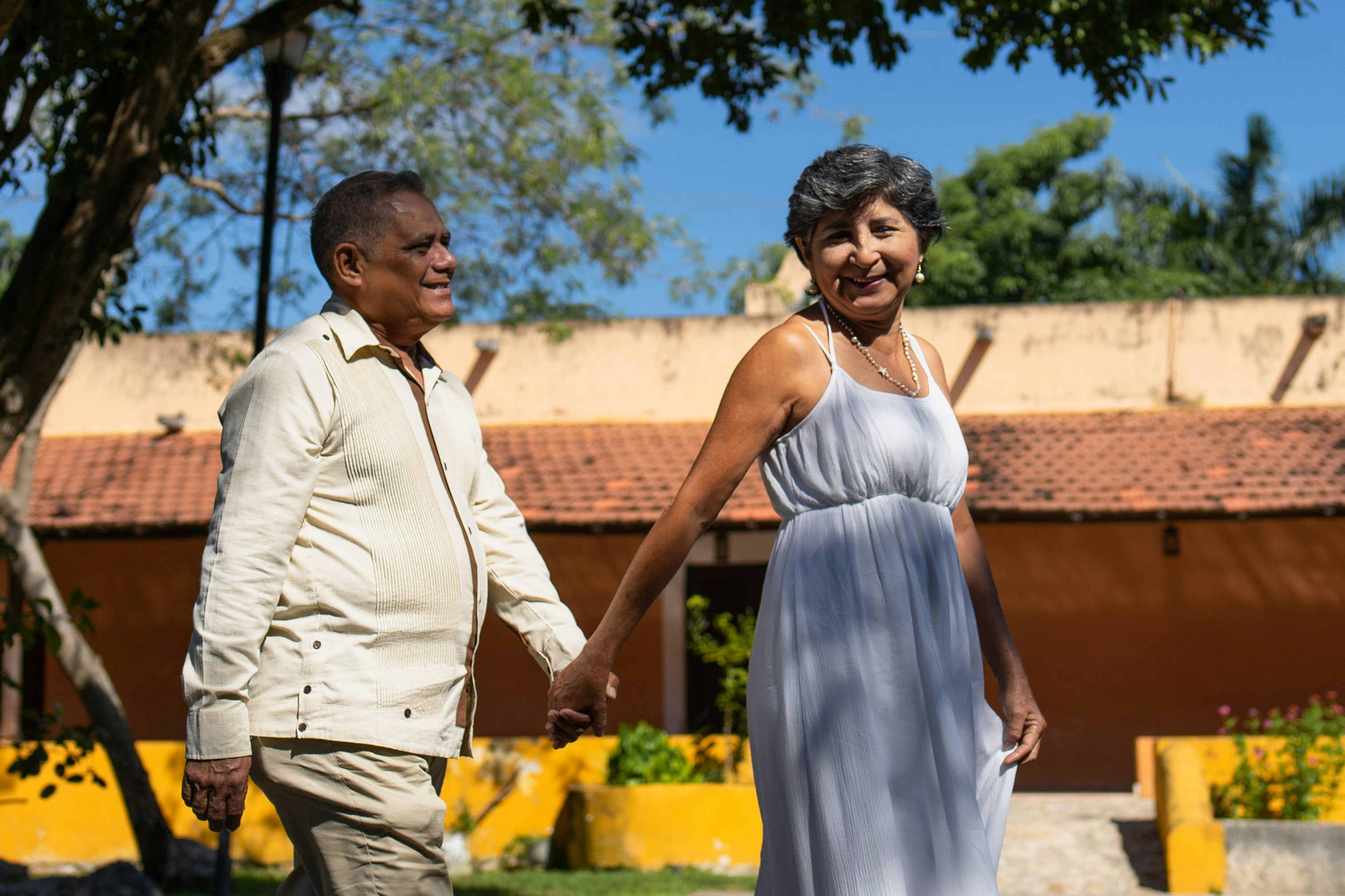 Sunlit Courtyard Stroll: A Quiet Moment of Togetherness