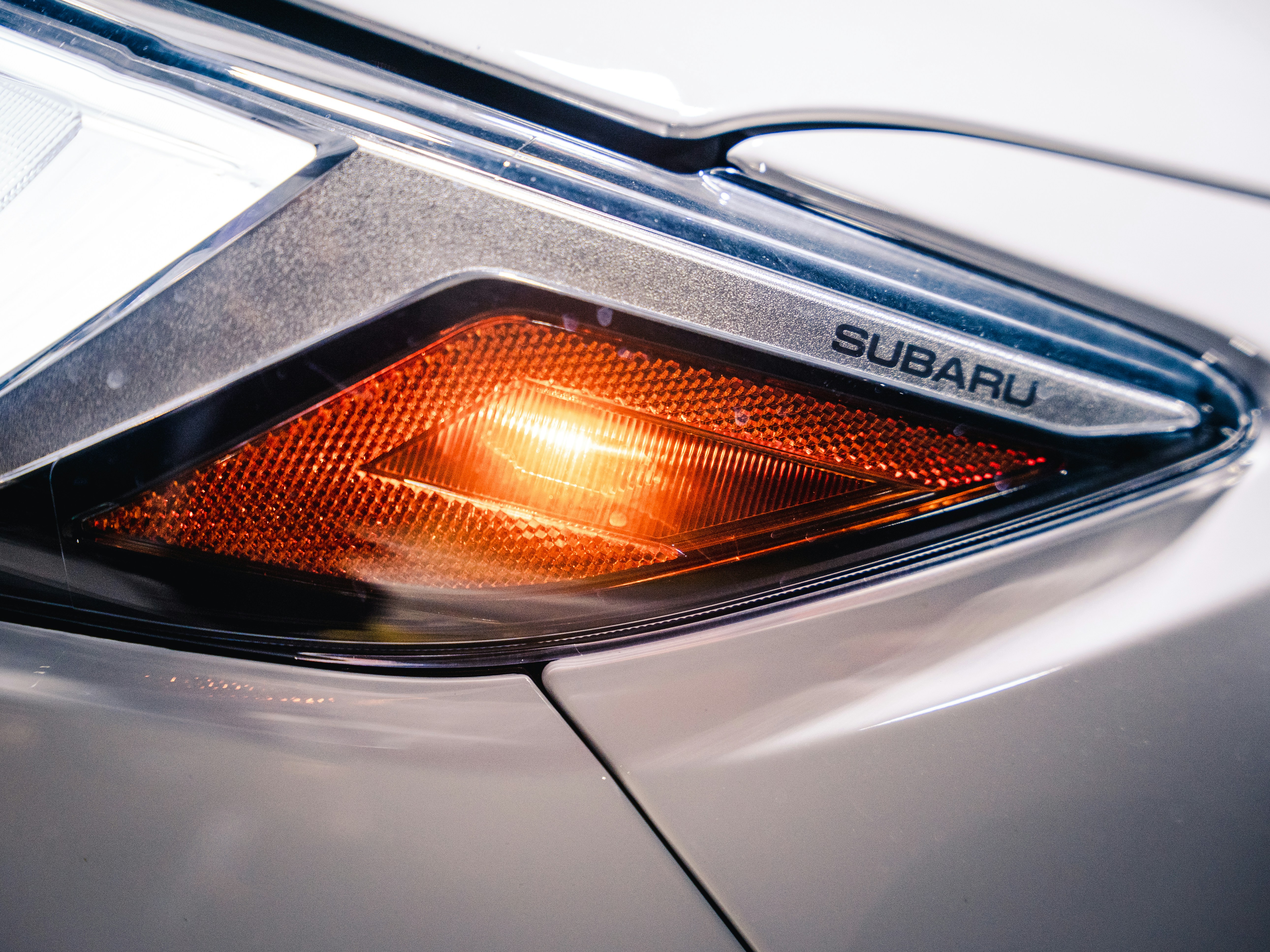 A subaru car's illuminated turn signal. photo – Free Image on Unsplash