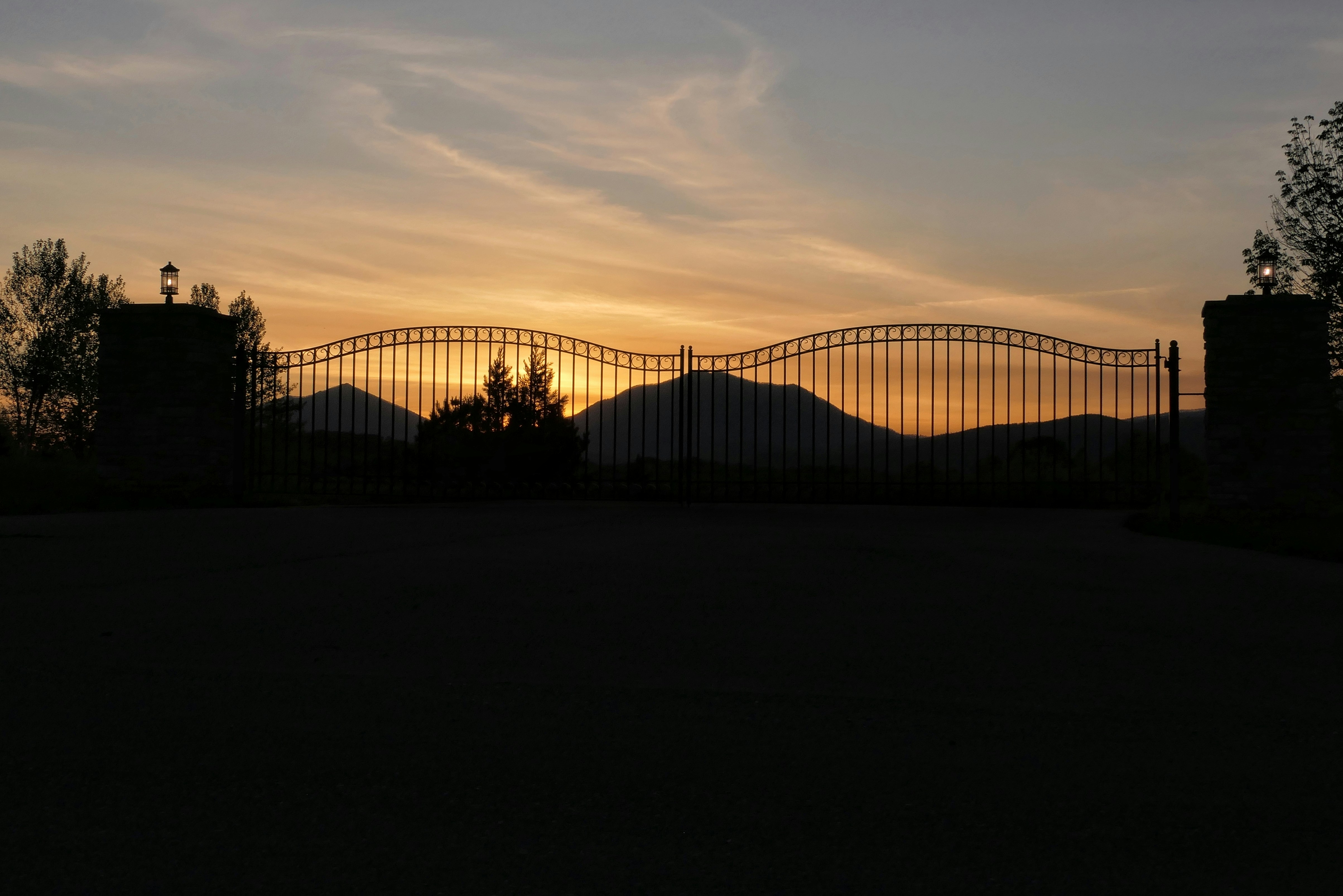 Dusk at the Iron Gate: Silhouettes Against a Mountain Horizon