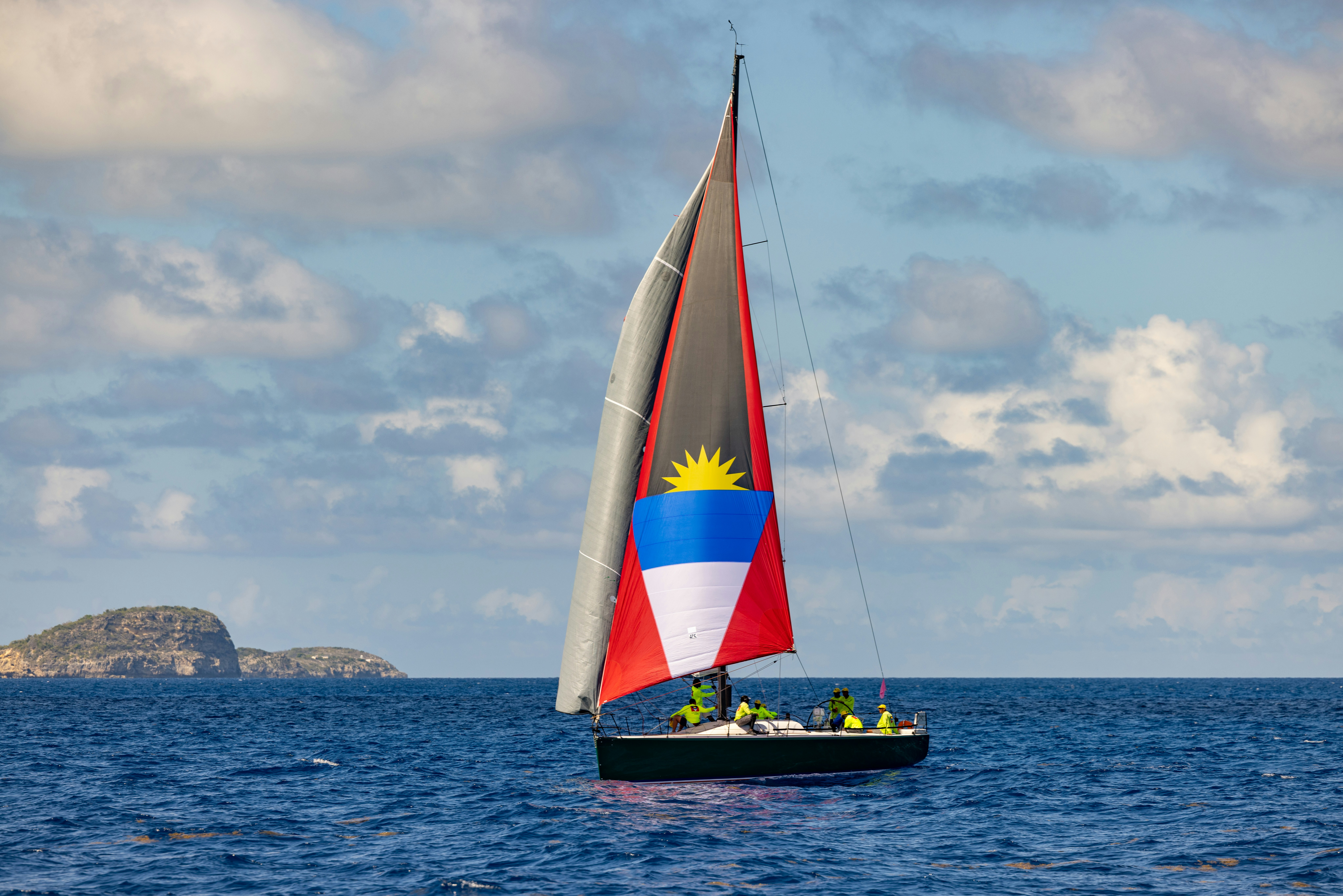 Sunburst Sail over a Sapphire Sea