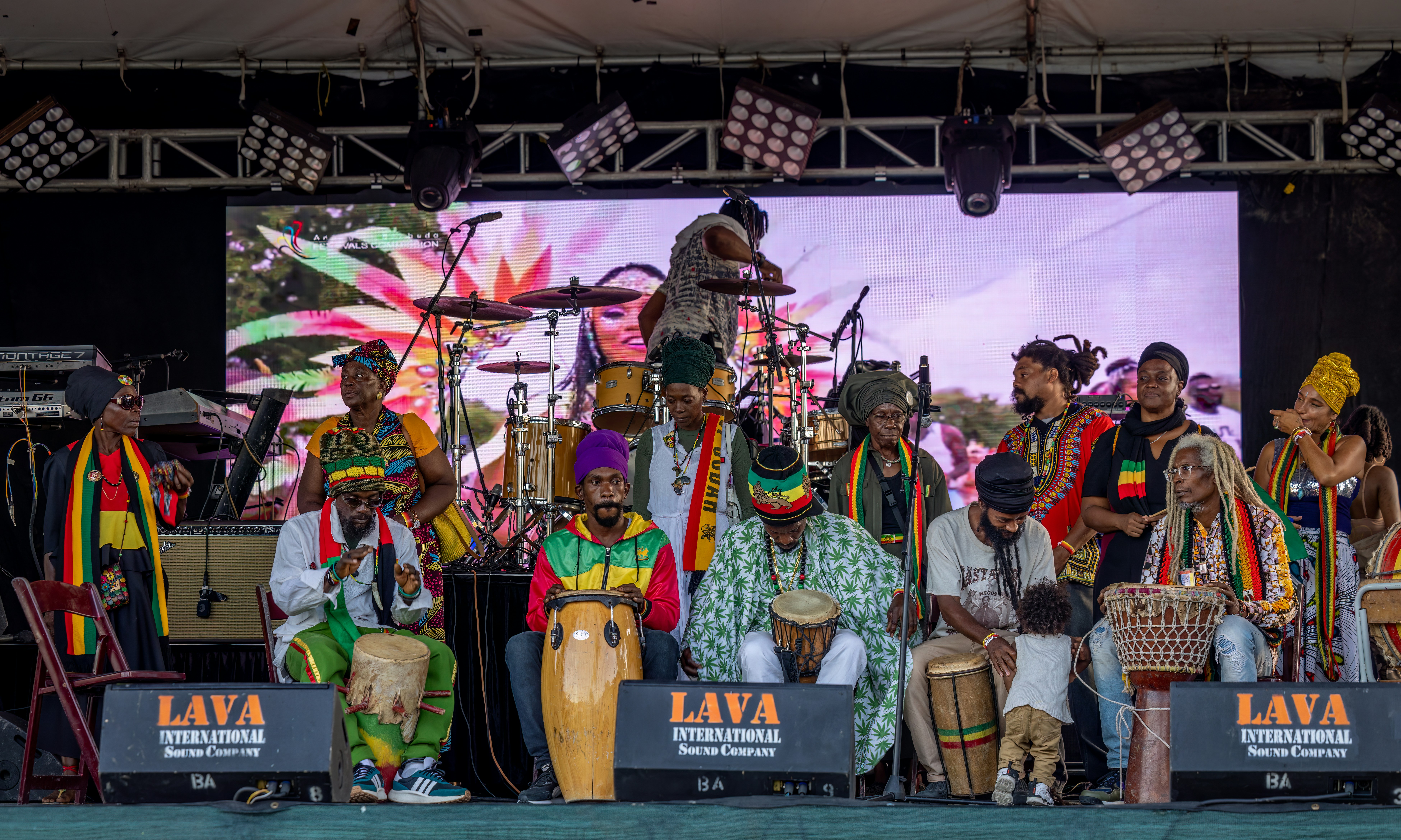 A large reggae band is performing on stage. photo – Free Man Image on ...