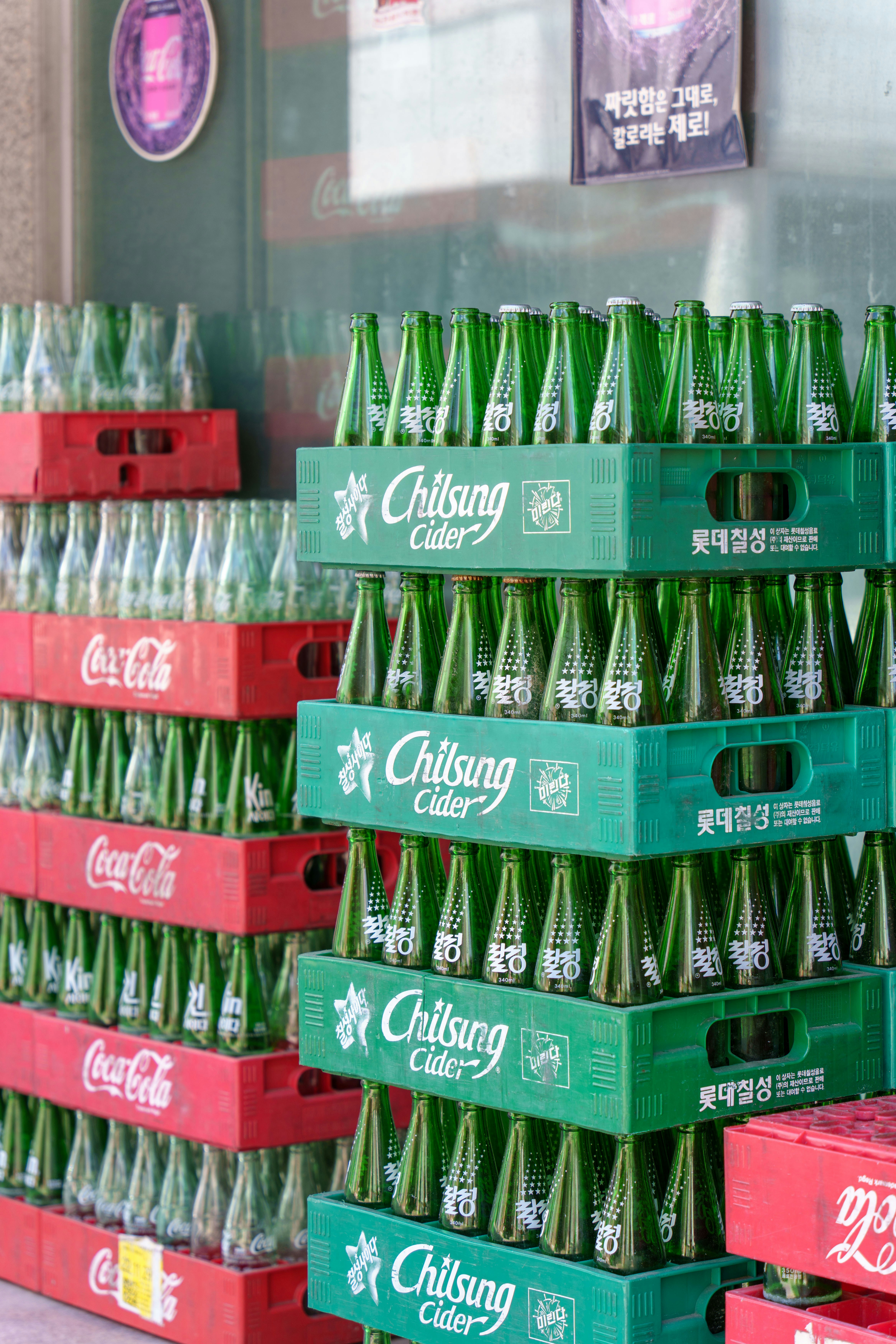 Vertical Surf of Green Bottles: Stacked Cider Crates