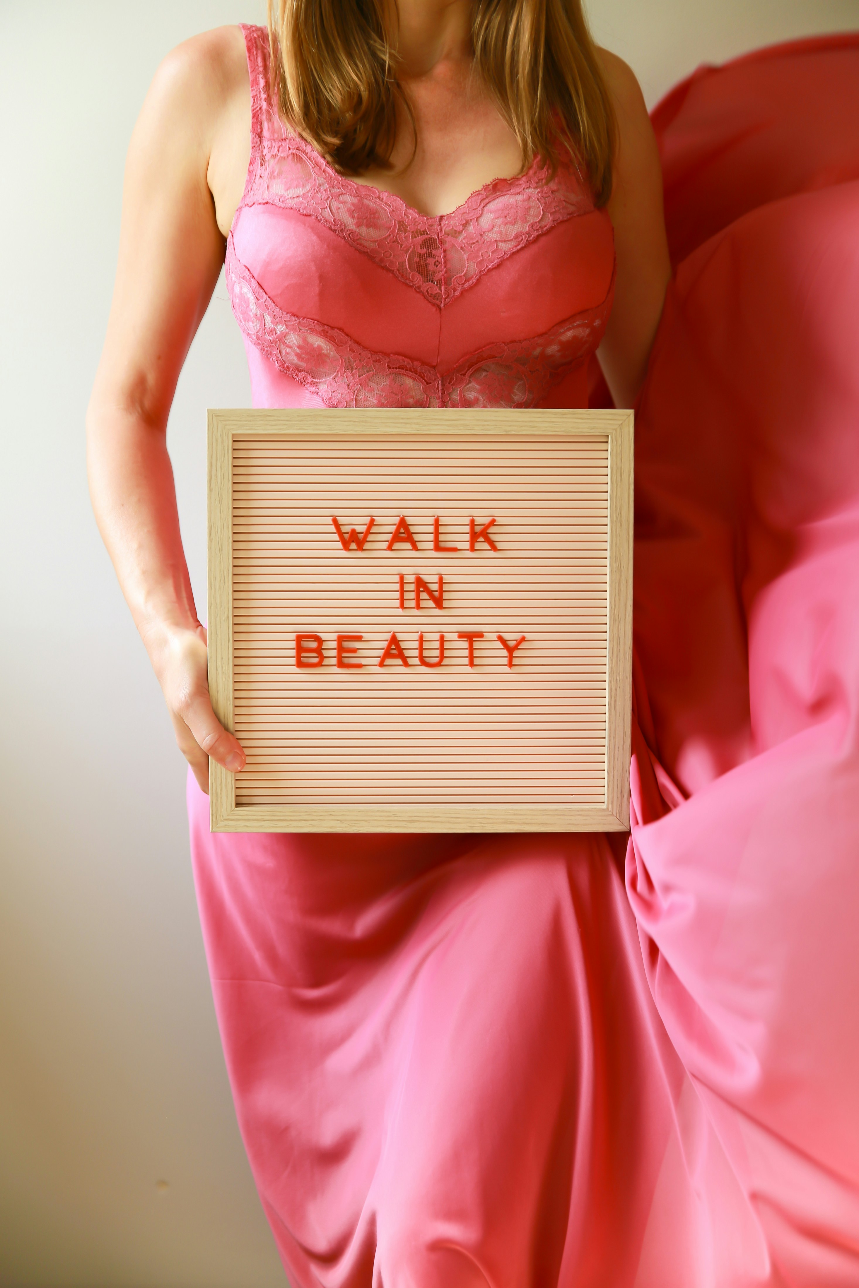 A woman holds a sign that says, "walk in beauty." photo – Free Woman ...