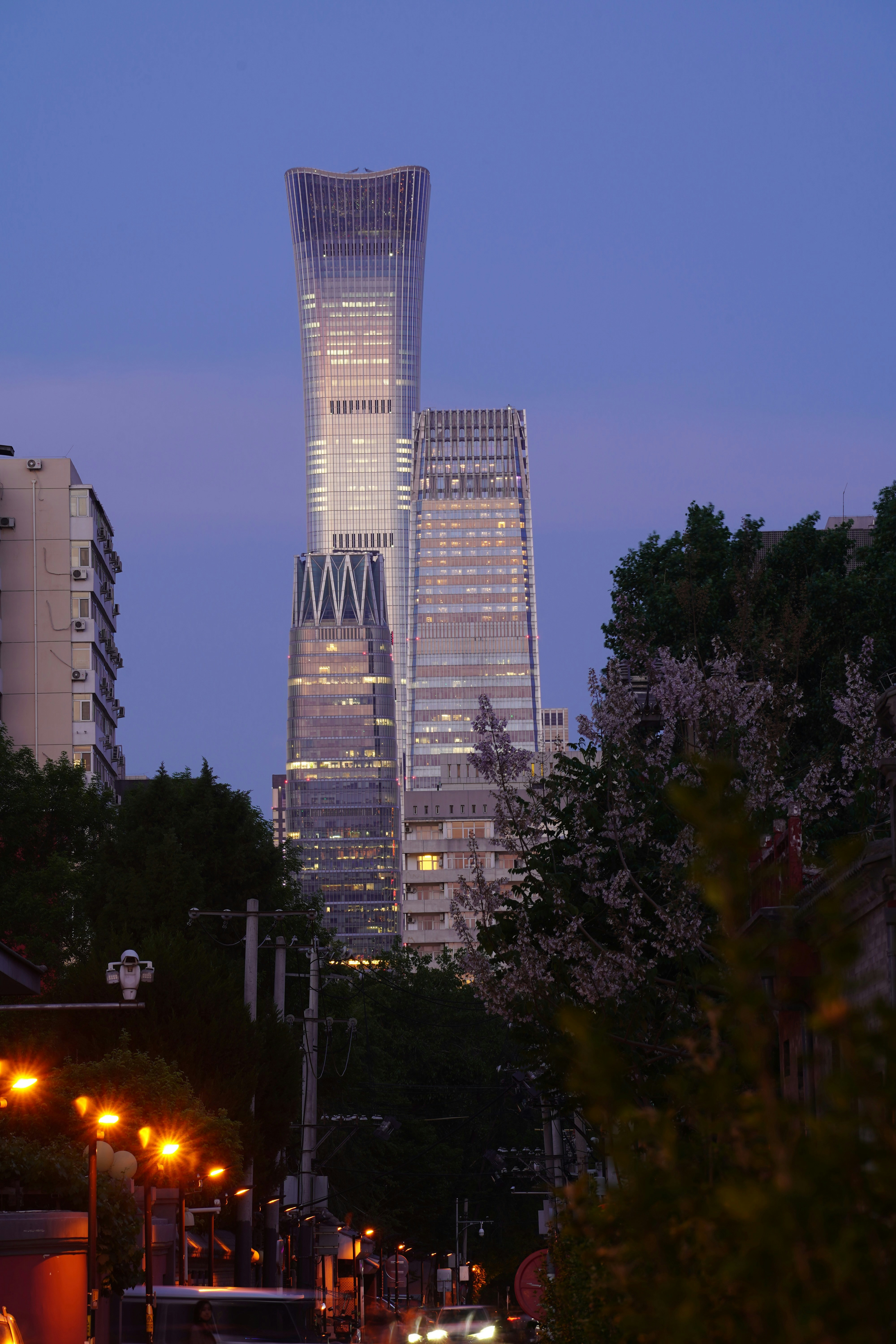 Blue Hour Giants: The Curved-Topped Tower Dominating a Quiet Street