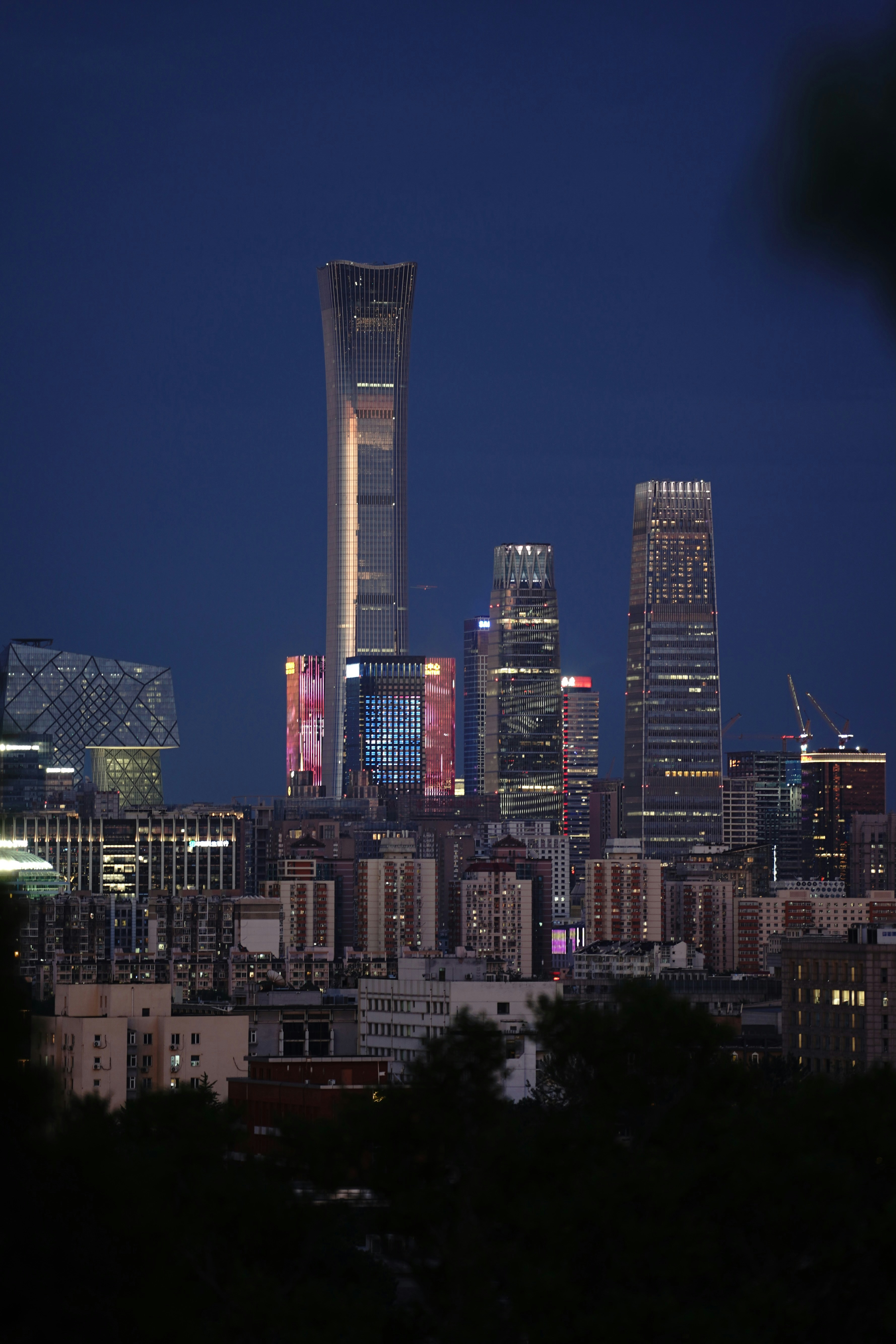 Neon Spire in the Blue Hour: A Cityscape of Glass and Light